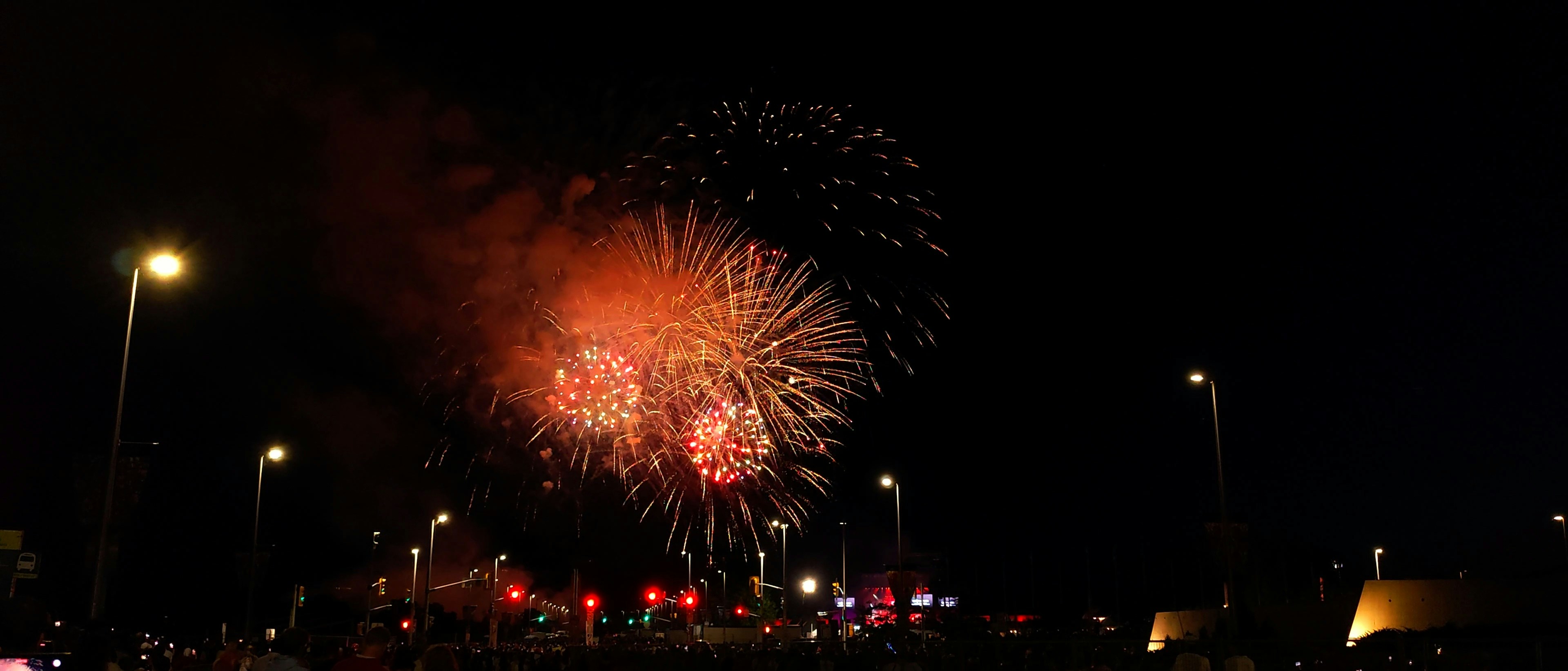 A large fireworks display in the night sky photo – Free Canada Image on ...