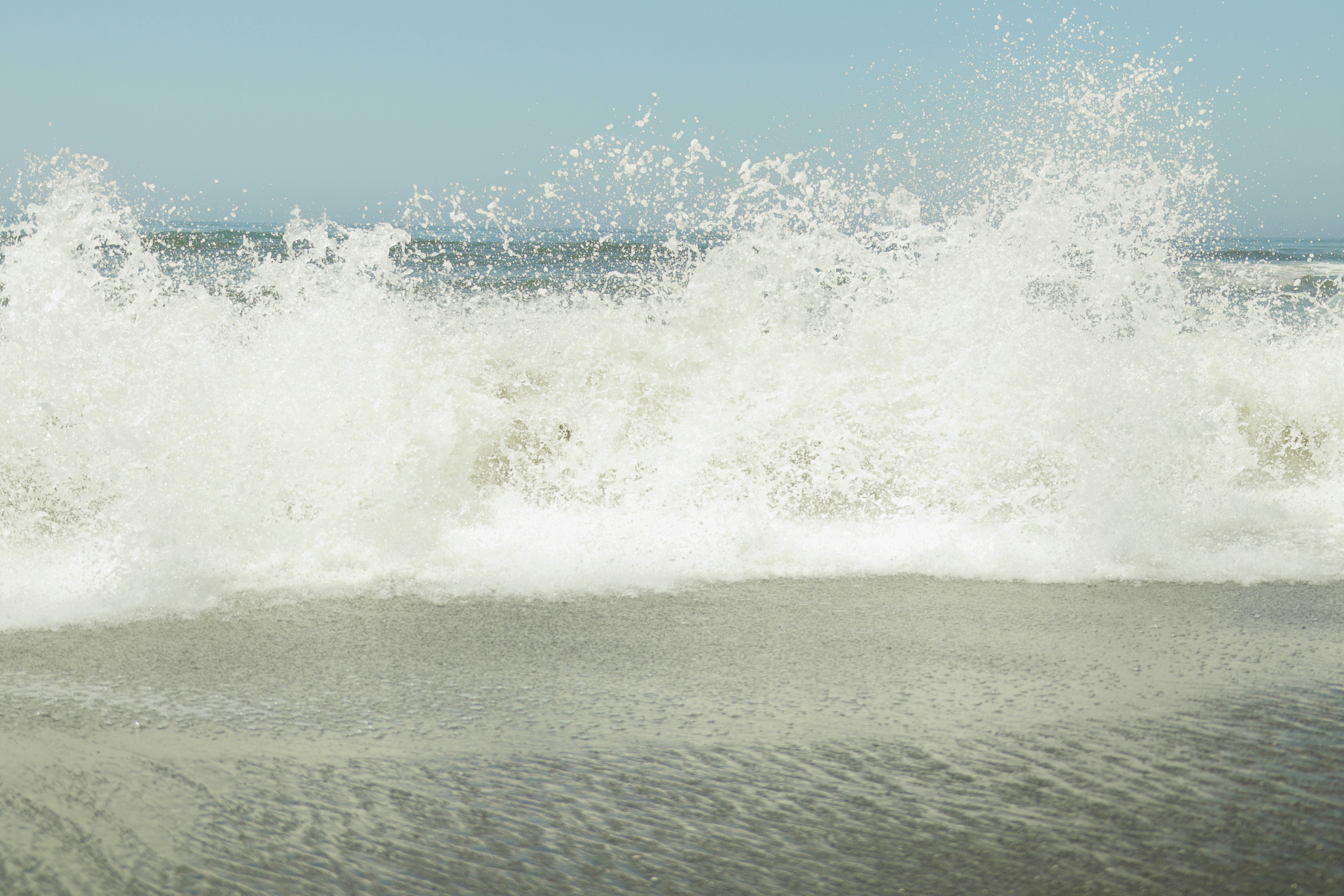 A man riding a wave on top of a surfboard photo – Free Elk Image on ...