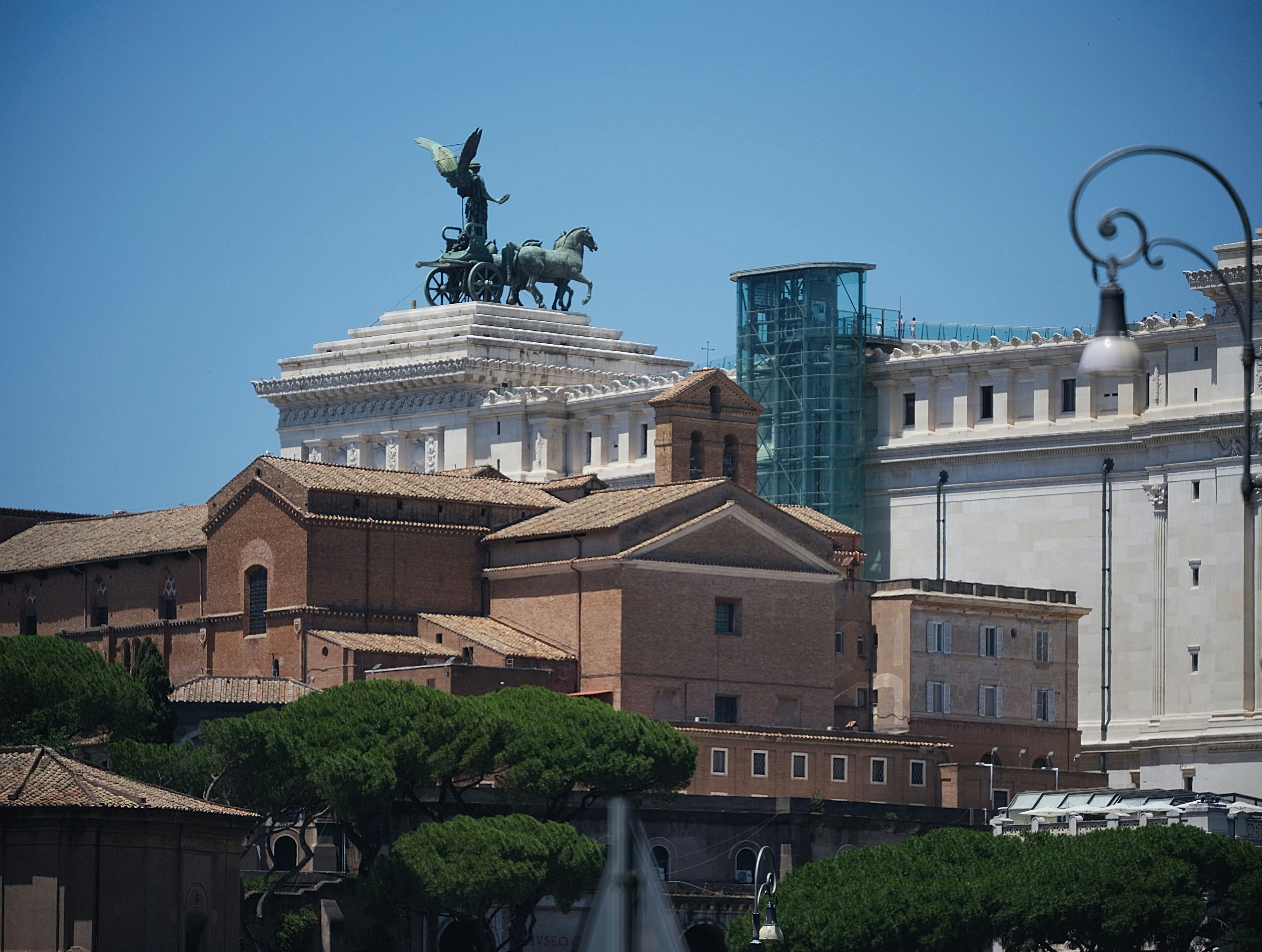 Equestrian Sentinel: The Vittoriano Looming Over Rome's Rooftops