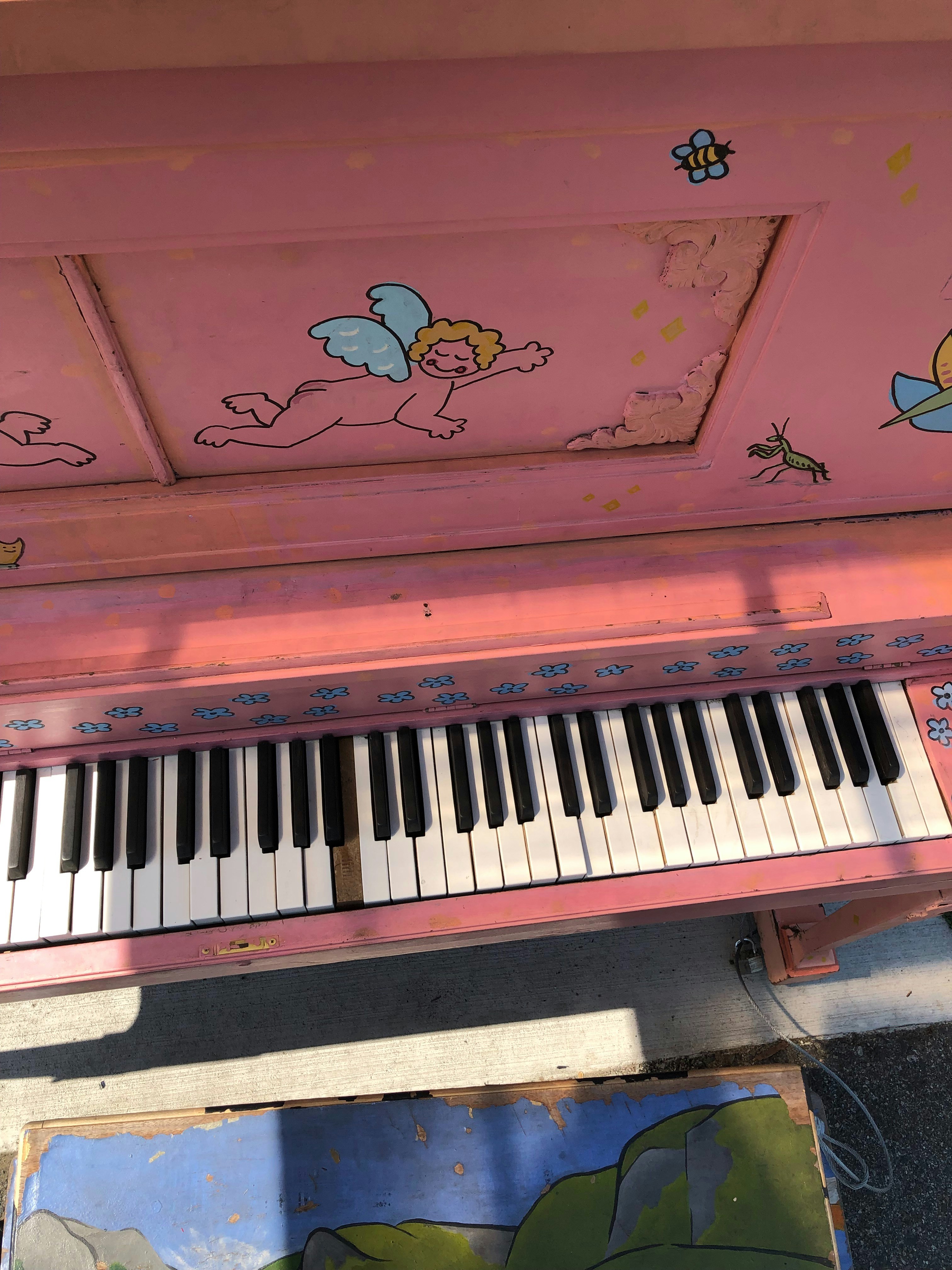 A pink piano with a picture of tinkerbells on it photo – Free Piano ...