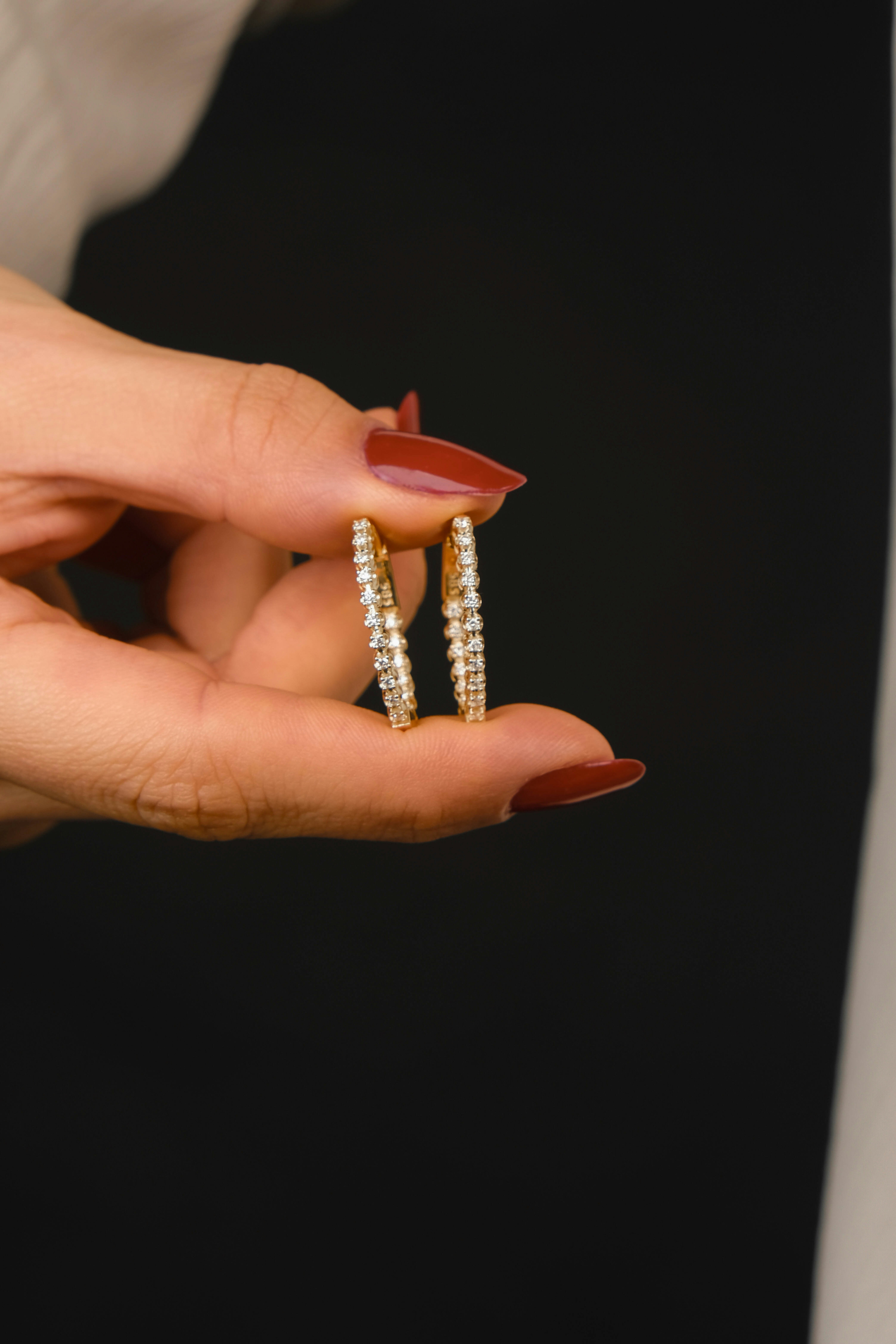 A woman holding two rings in her hand photo – Free Accessories Image on ...
