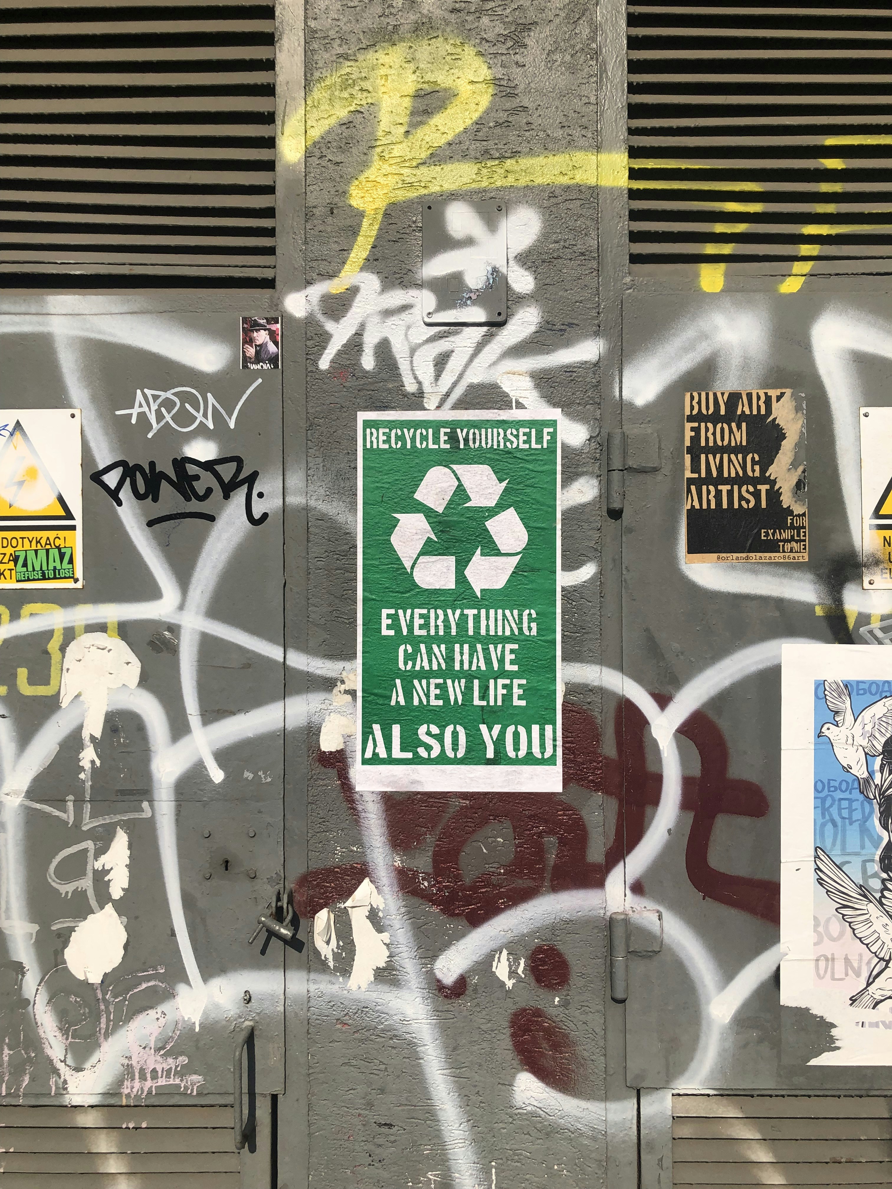 A bunch of graffiti on the side of a building photo – Free Warsaw Image ...