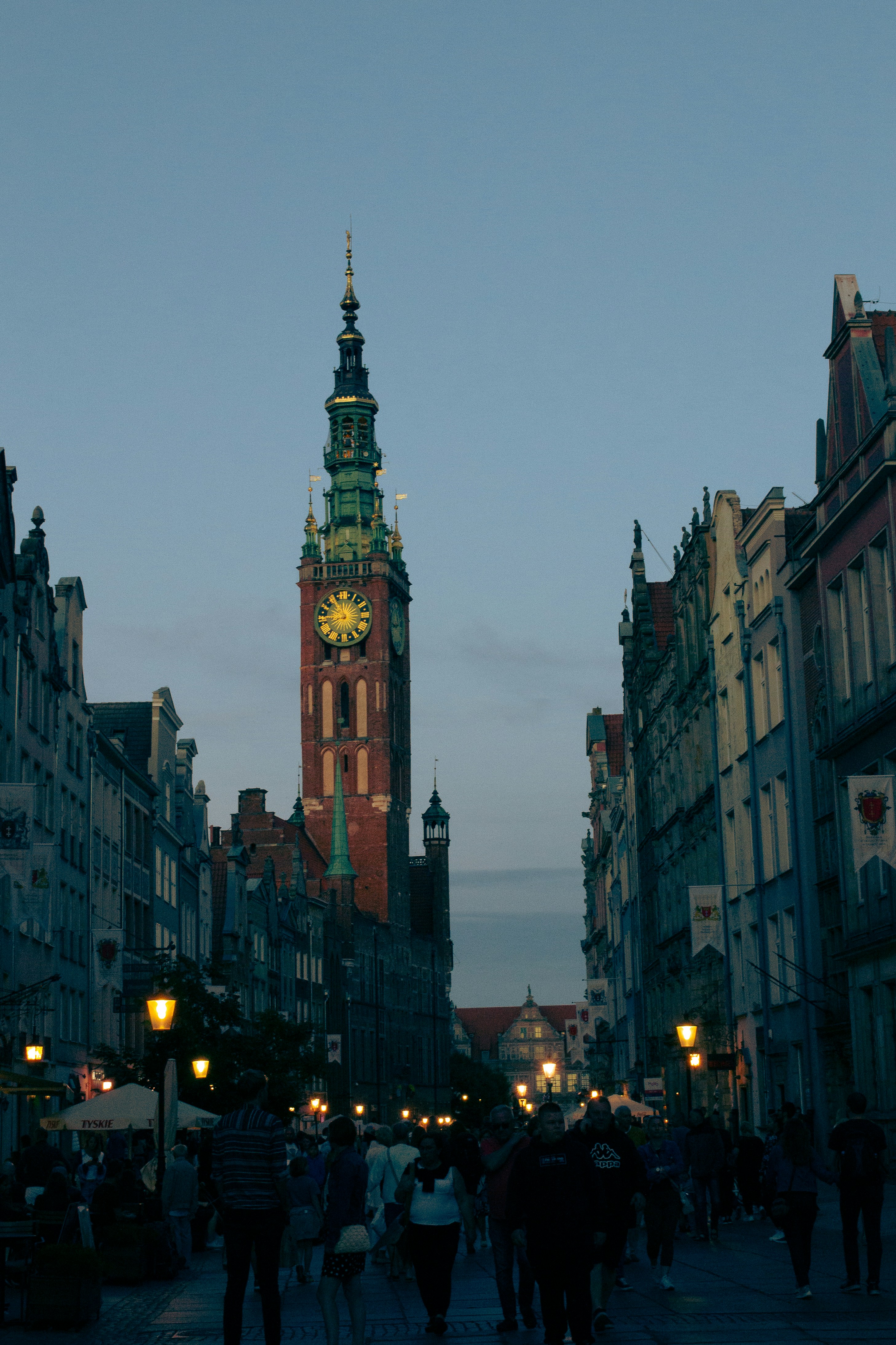 A large clock tower towering over a city street