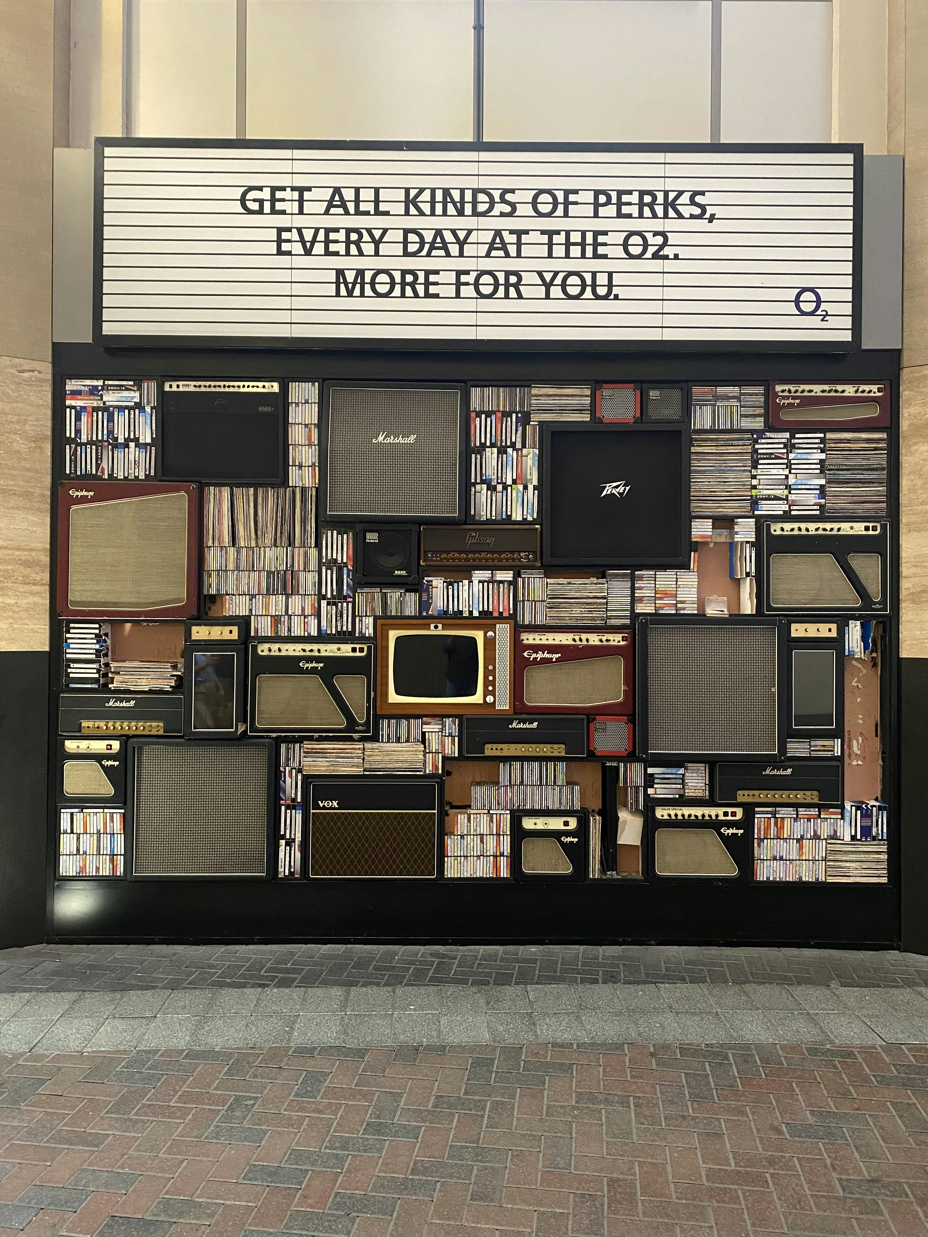 A sign that says get all kinds of perks every day at the q2 photo ...