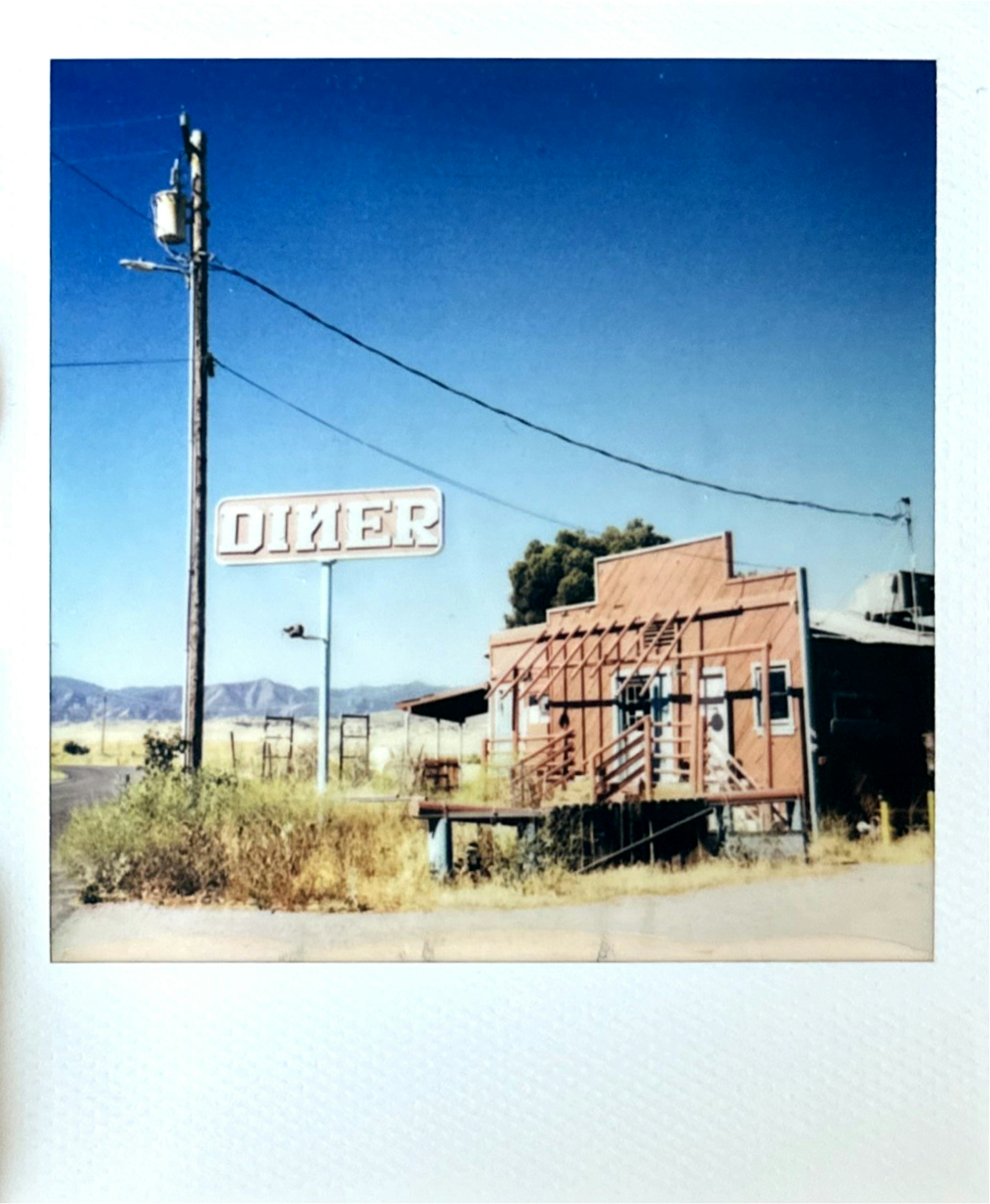 A sepia photograph of an old gas station photo – Free Art Image on Unsplash