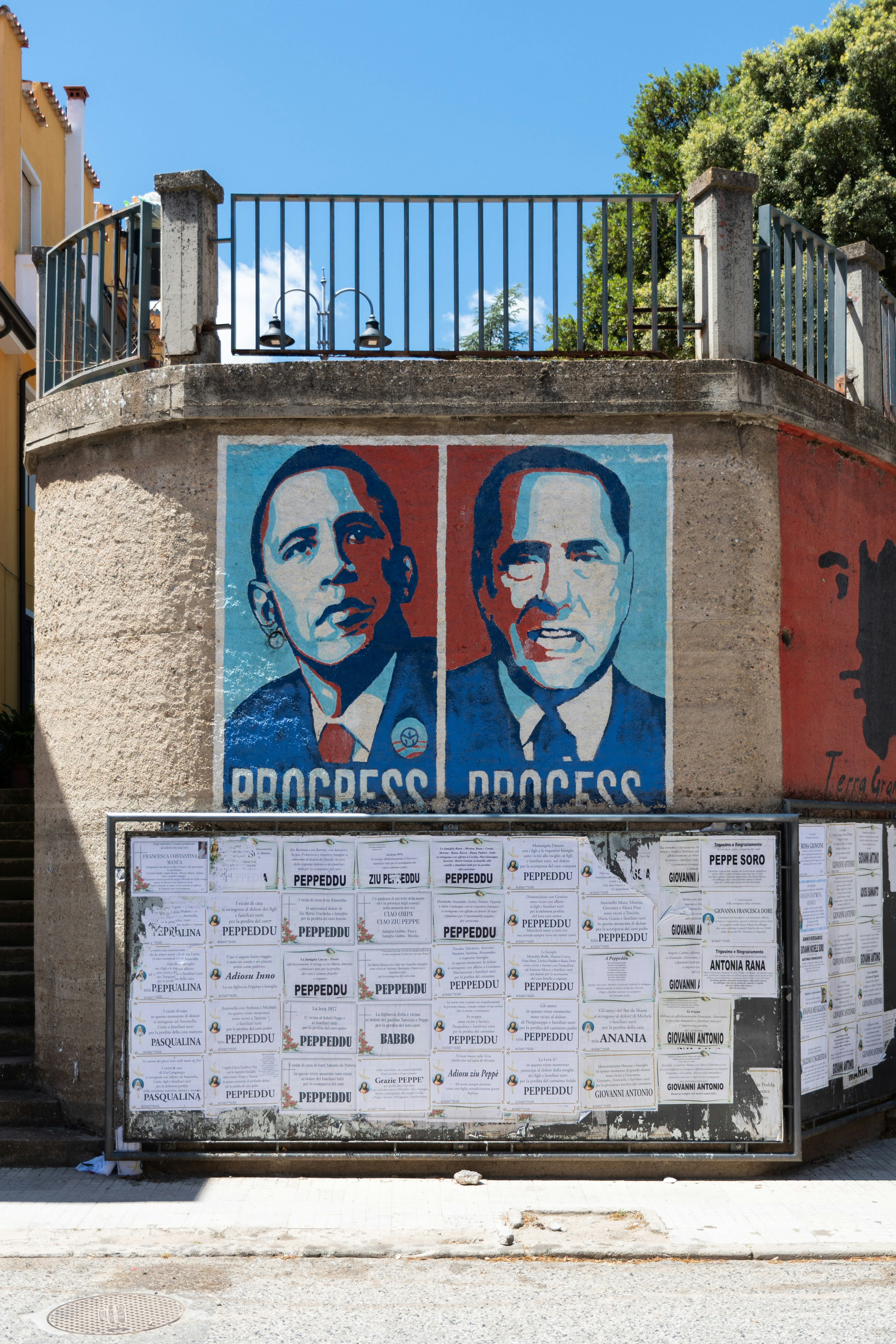 A building with two political posters on it photo – Free Woman Image on ...