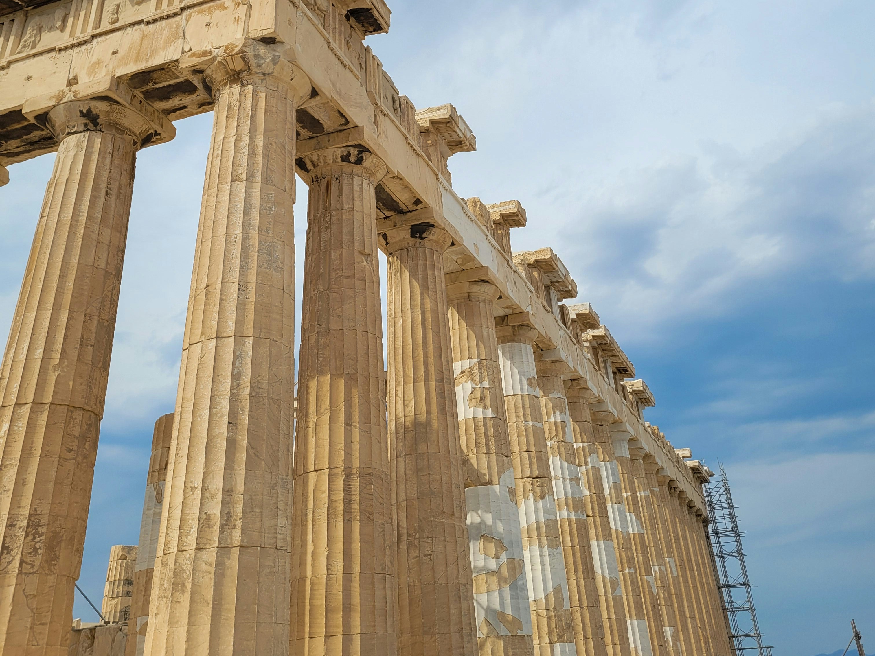 A large stone structure with a clock on top of it photo – Free ...