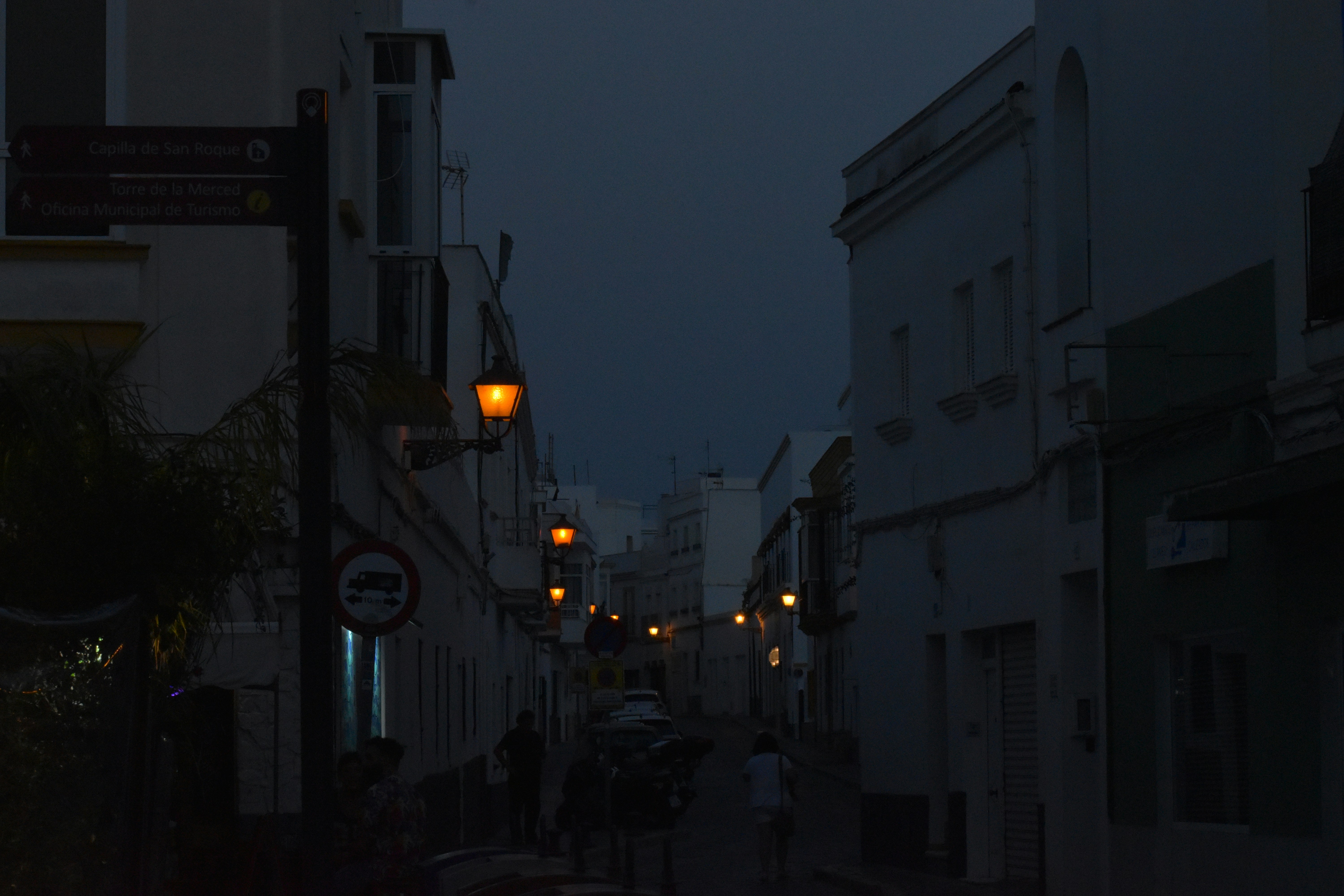 Lanterns Along a Narrow Street: A Quiet Dusk Journey into the Distance