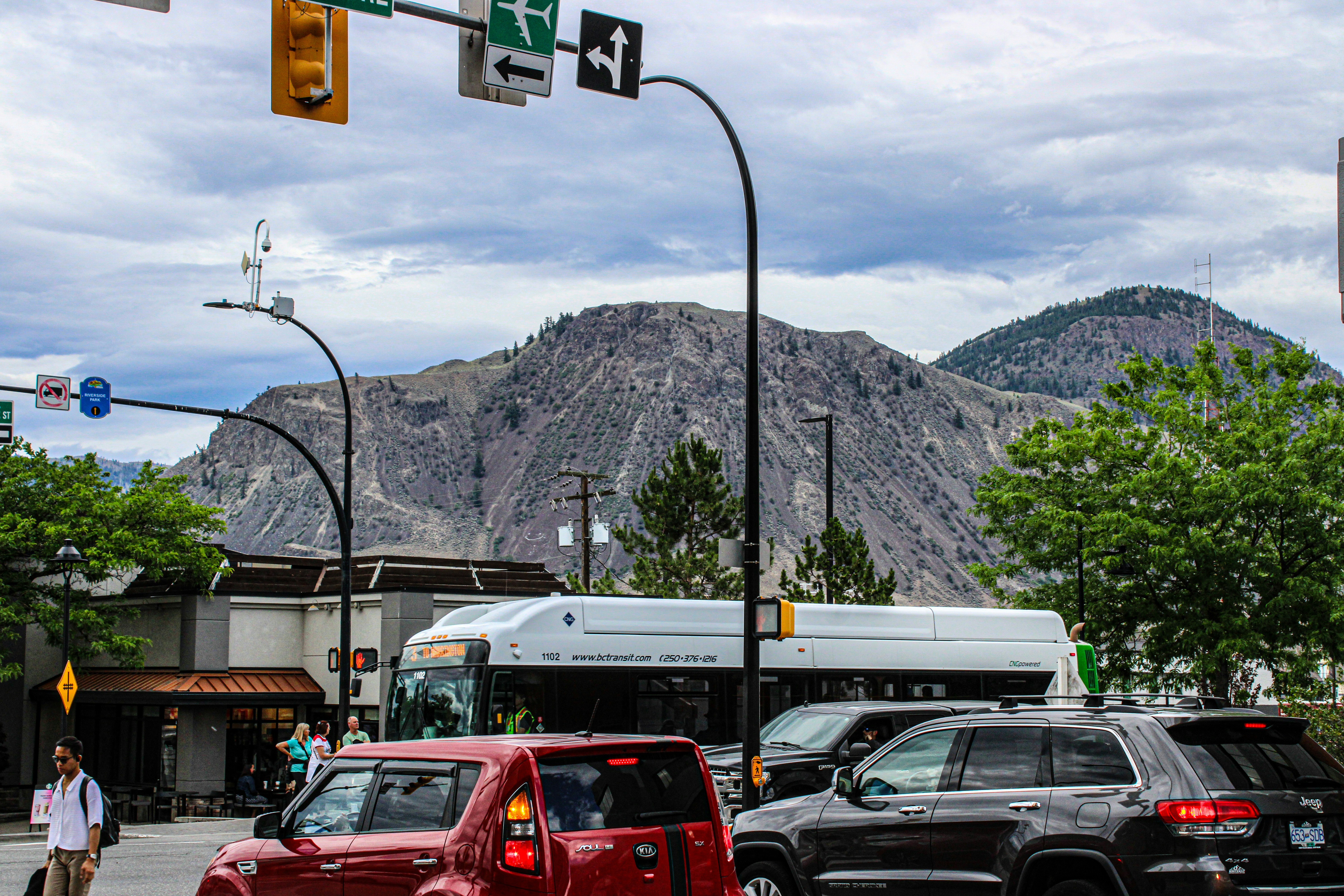 Crossroads at Mountain Town: A Busy Day With Buses and Traffic