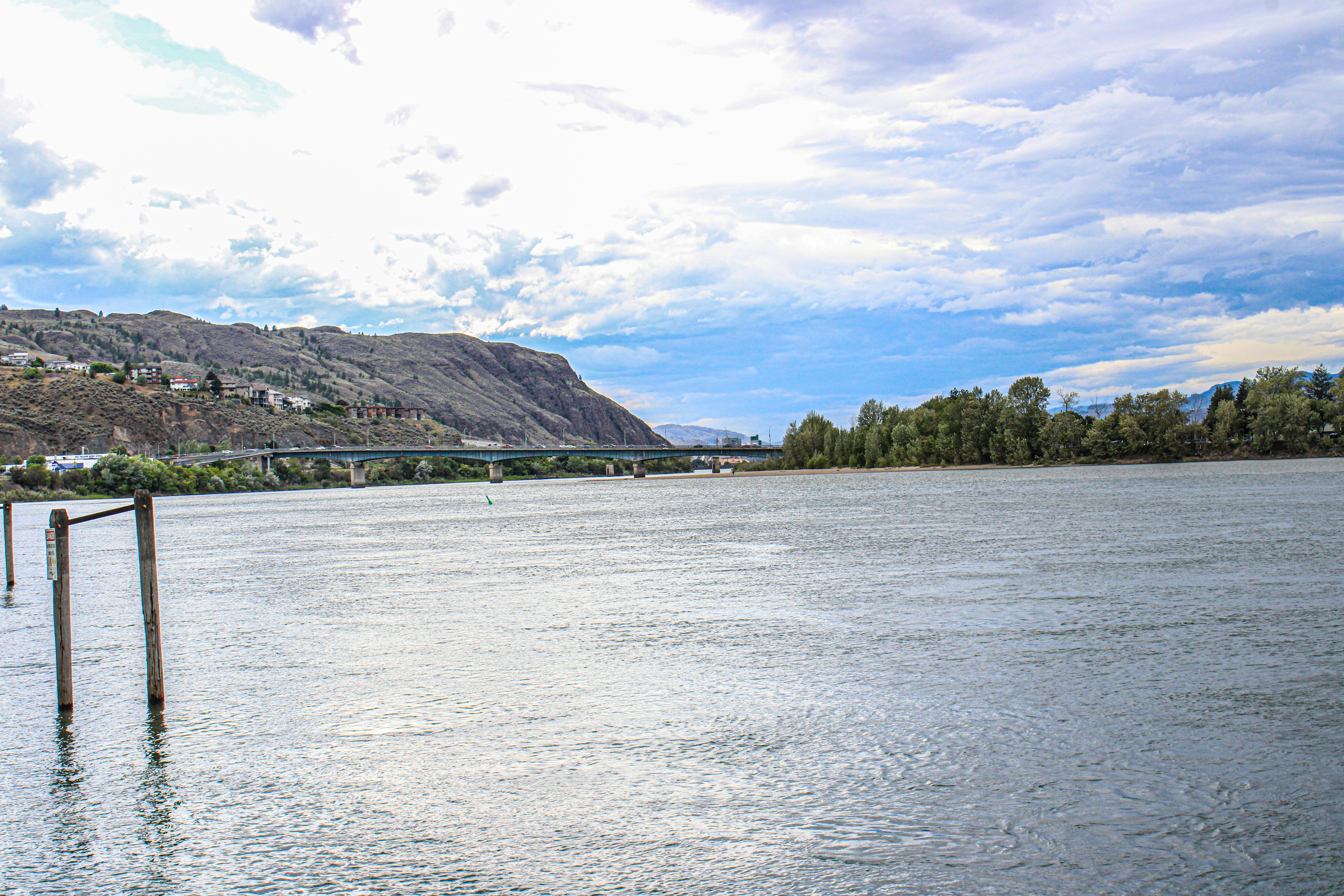 A body of water that has some poles in it photo – Free Kamloops Image ...