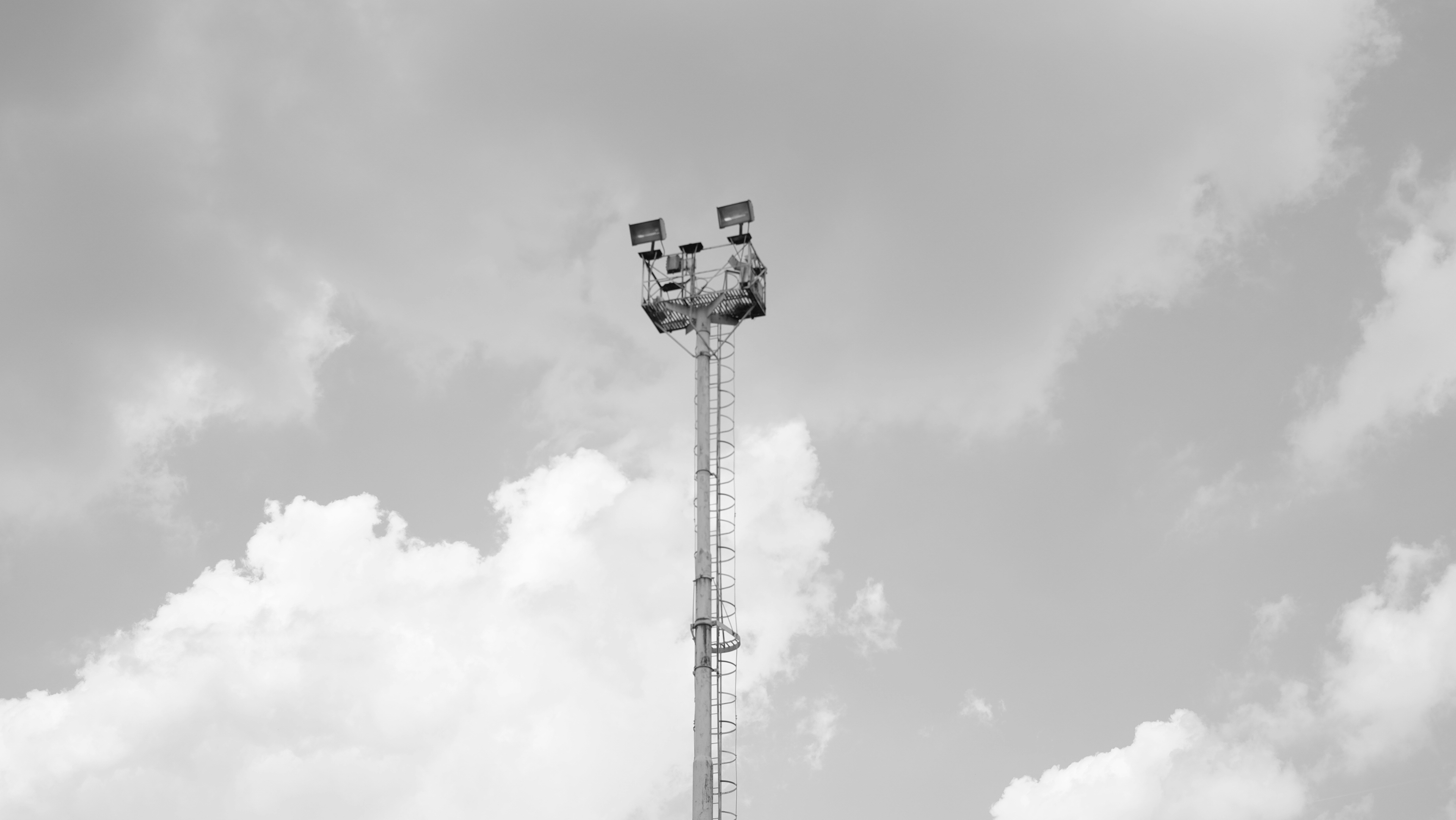 Ridge of Light: A Lone Stadium Tower Pierces the Sky