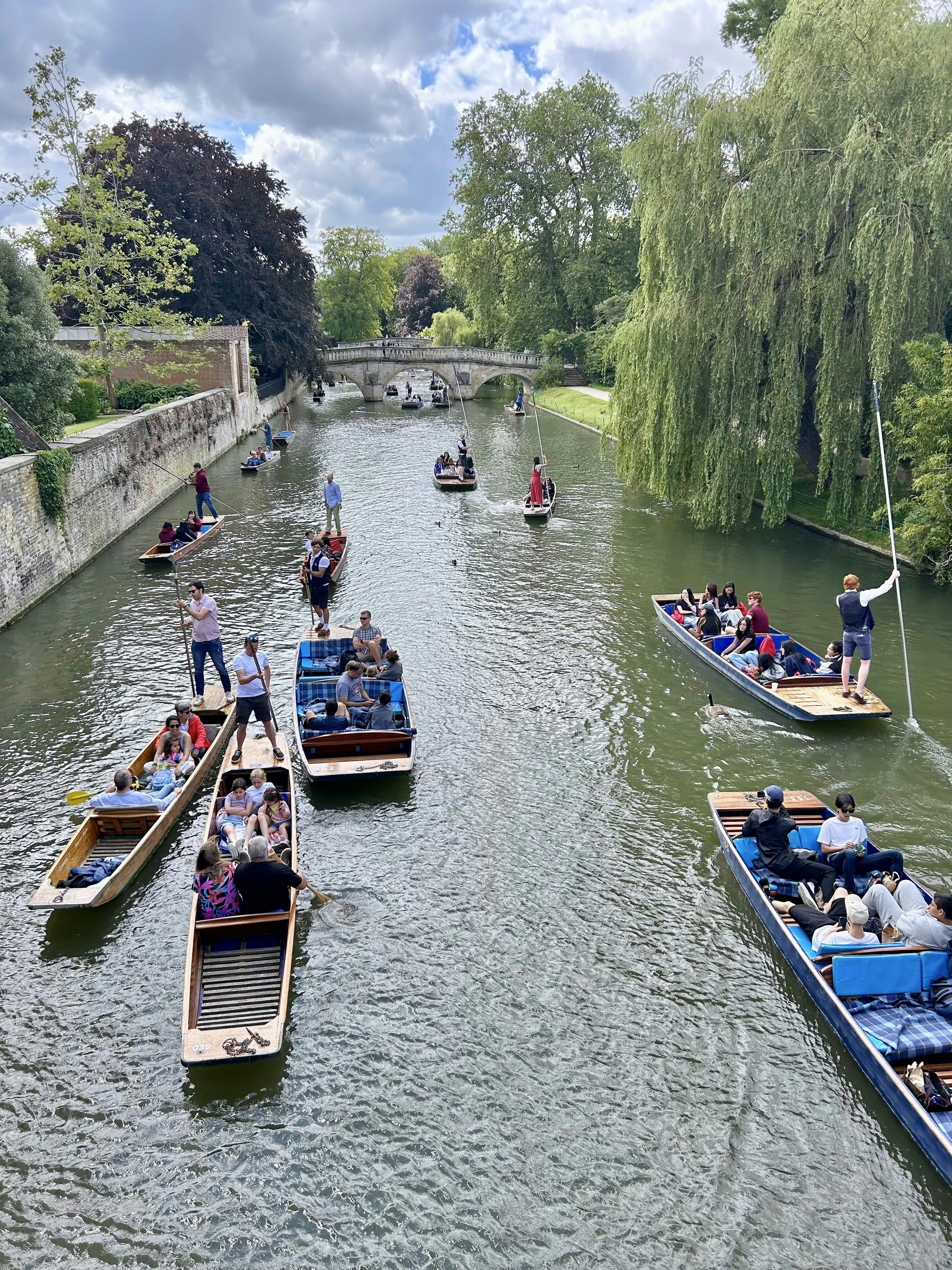 A group of people riding boats down a river photo – Free Cambridge ...