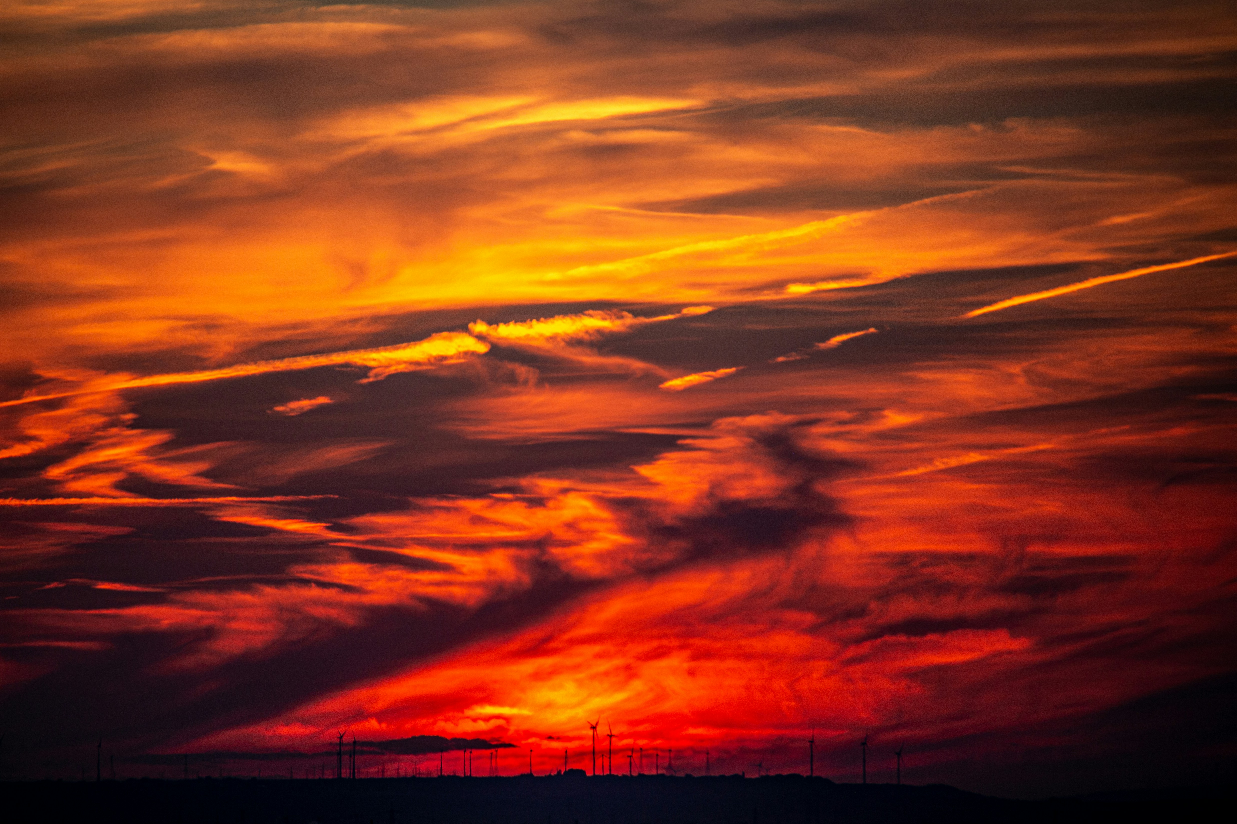 A red and yellow sunset with clouds in the sky photo – Free Germany ...