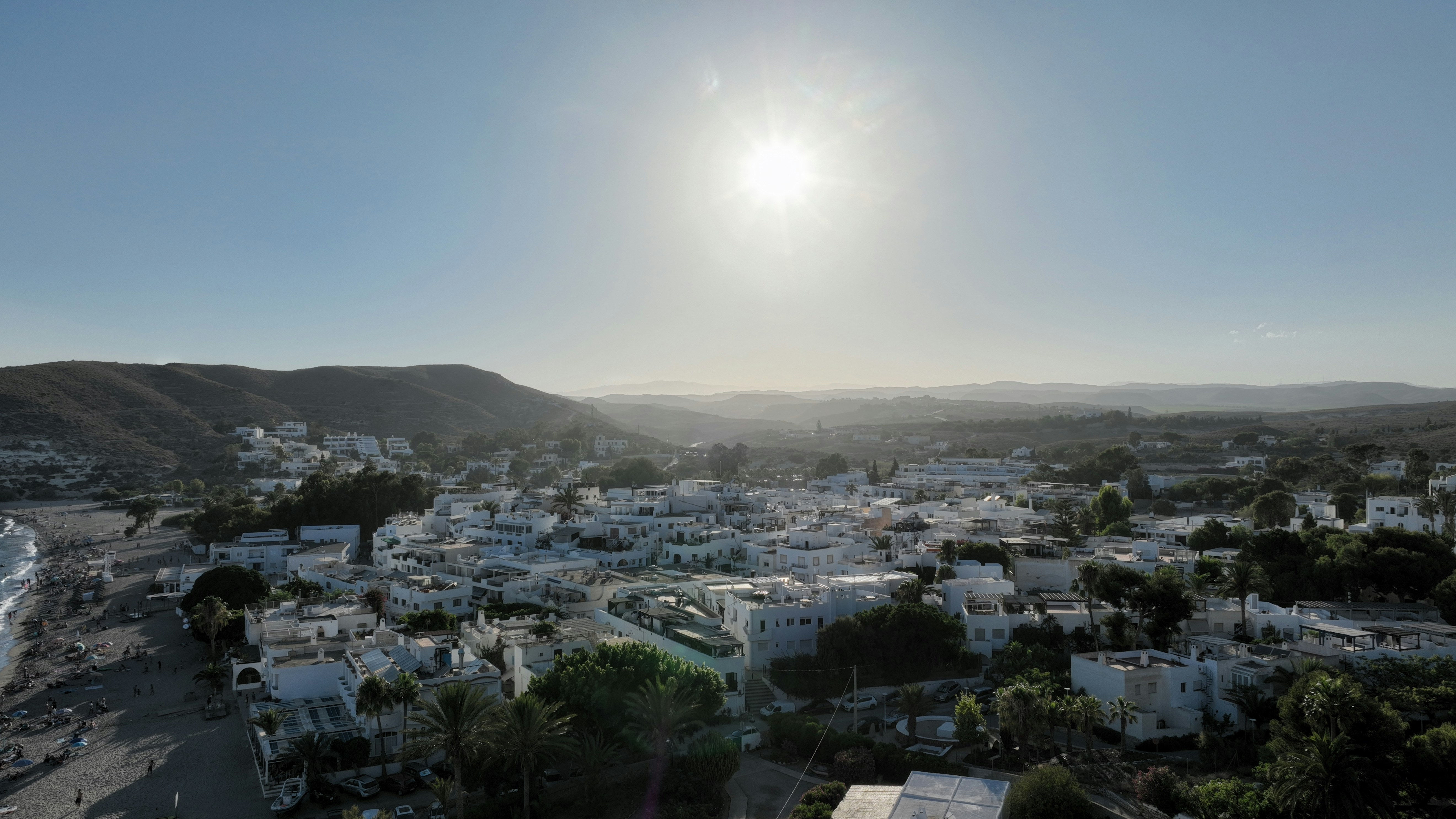 Sunlit Panorama Over White-Washed Hills