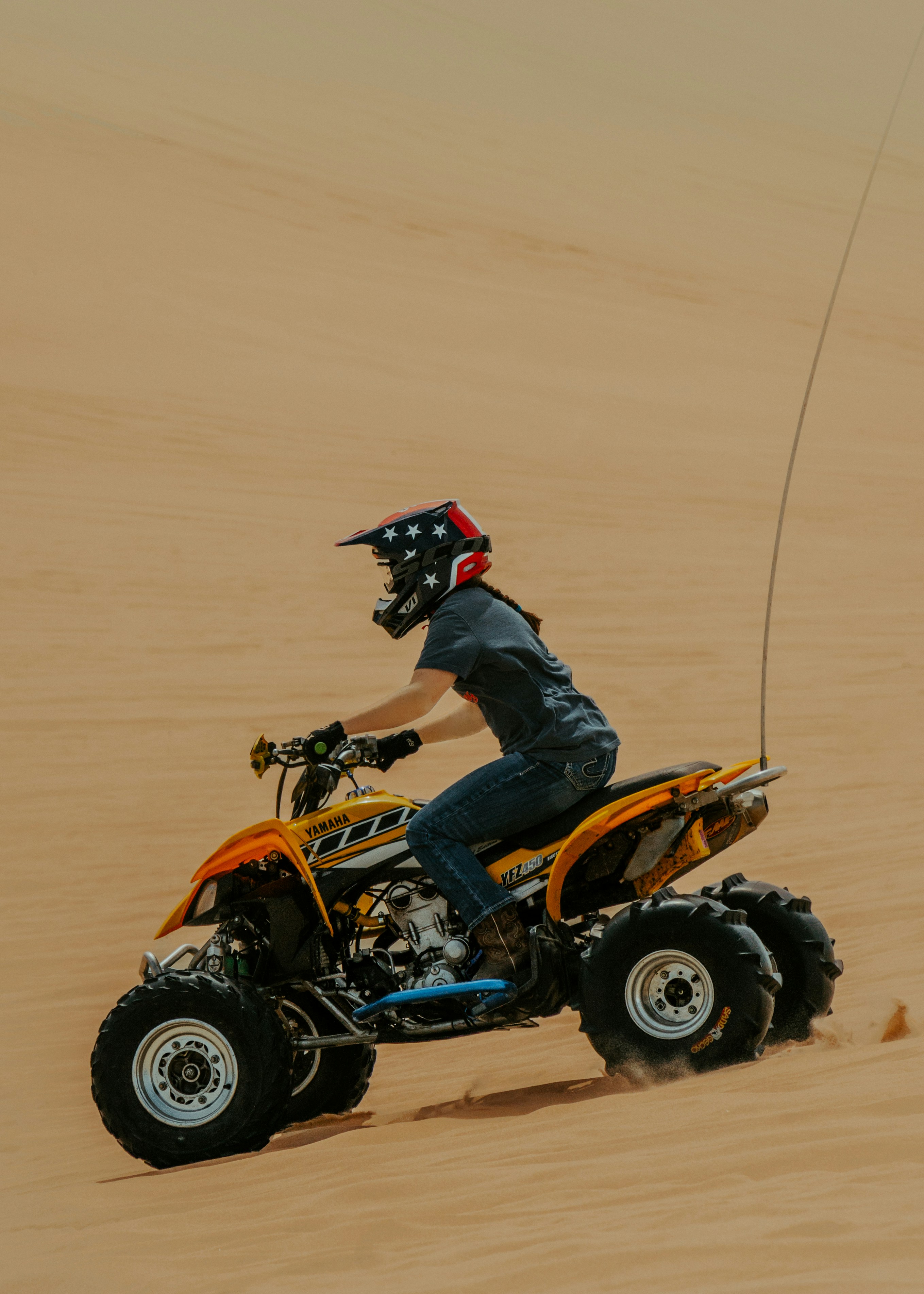 A man riding an atv in the desert photo – Free Silver lake sand dunes ...