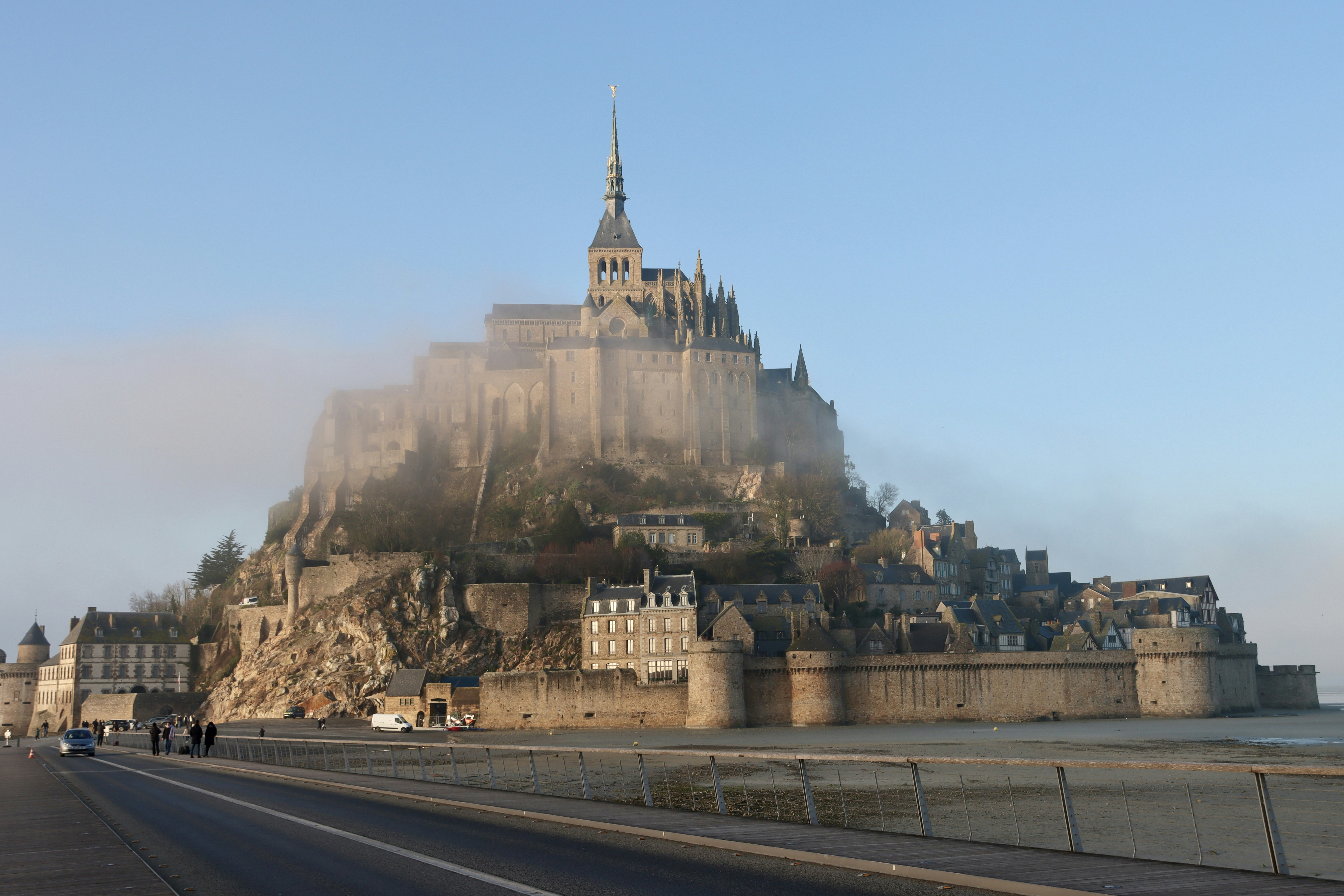 Mont-Saint-Michel in Morning Fog: The Granite Citadel Rising Over Quiet Tides