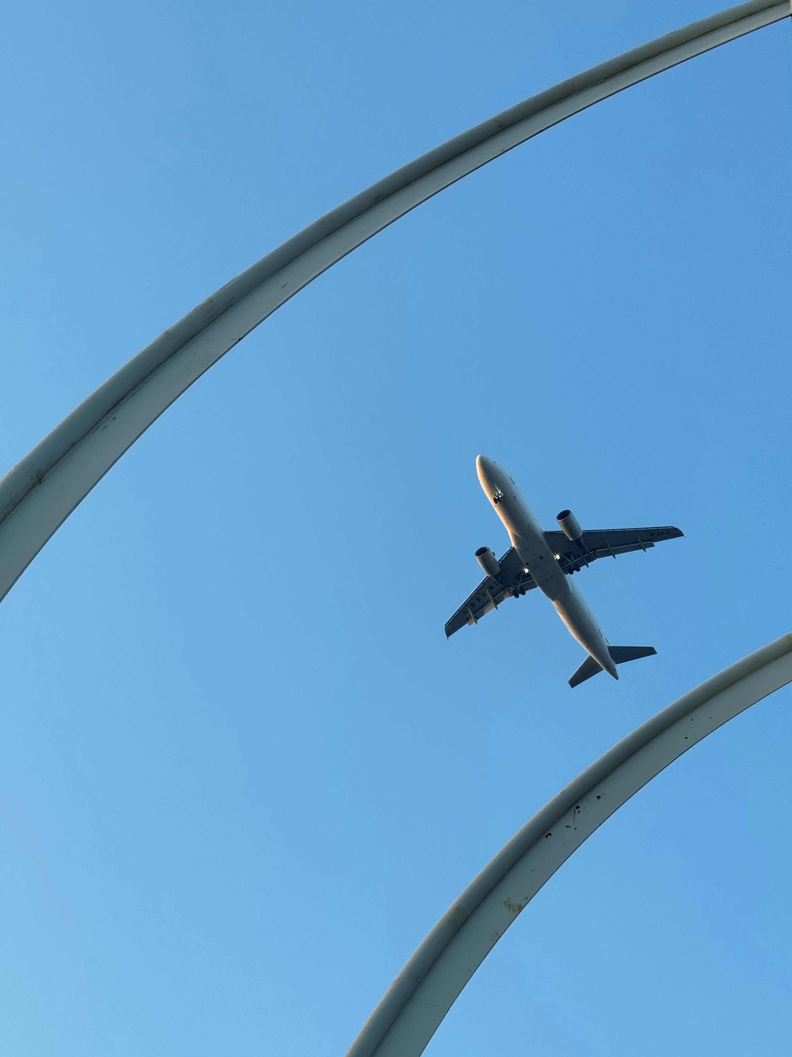 Jet Between Arches: A Skyward Crossing