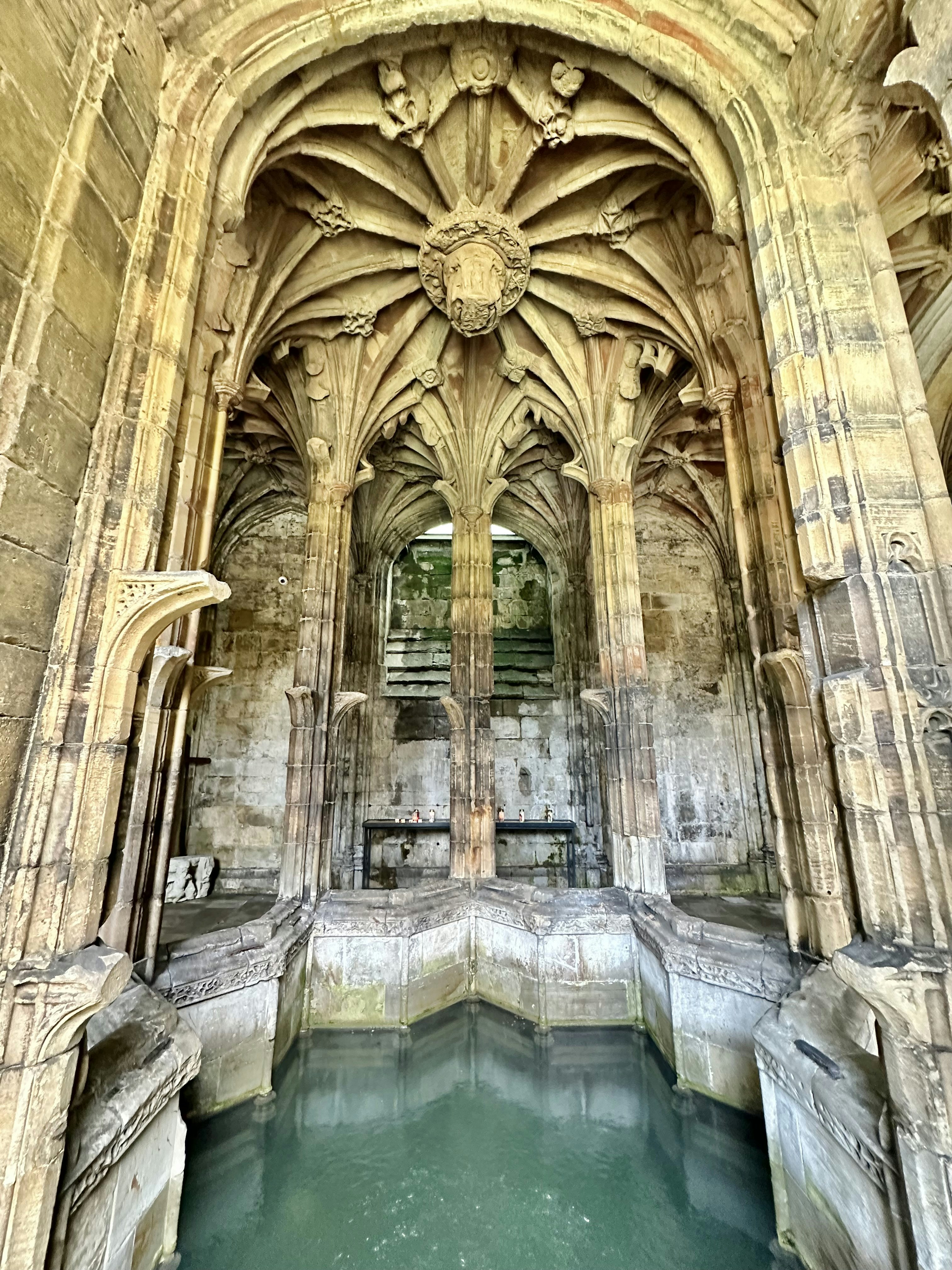 Stone Choir: Rib Vaults Framing a Quiet Water Basin