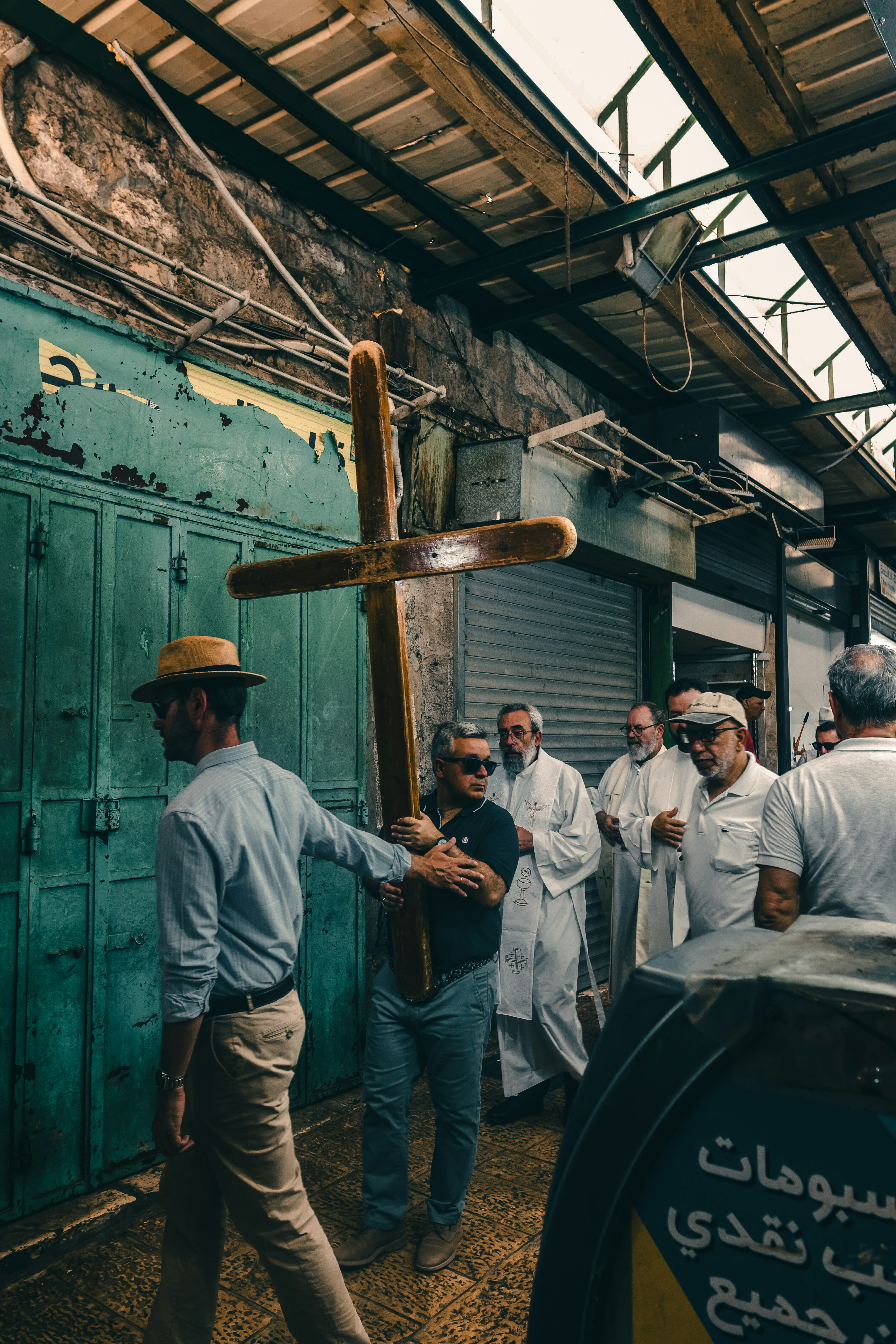 The Procession of the Cross: A Quiet Moment Amid Industrial Ruins