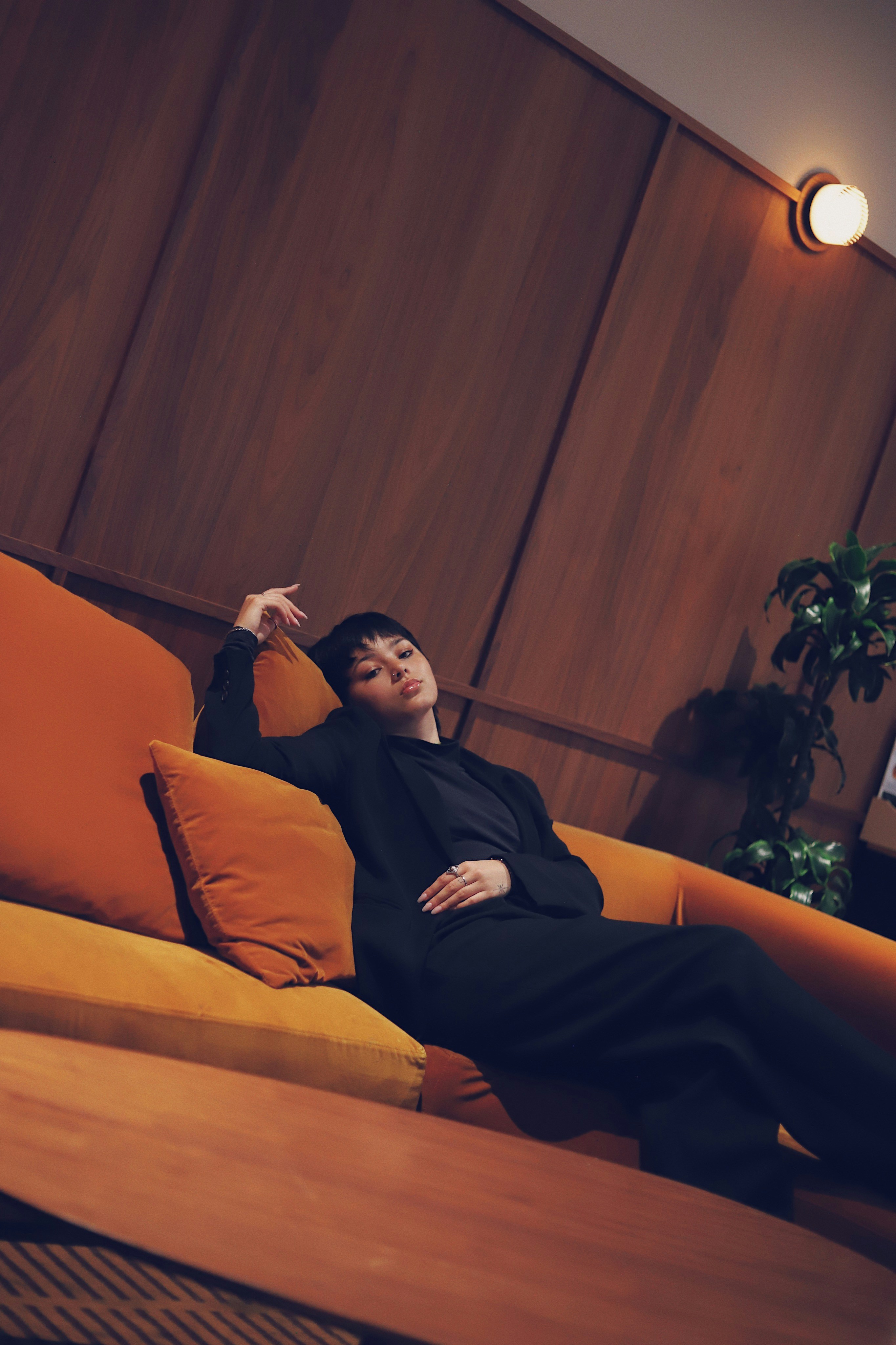 A person laying on a couch in a room photo – Free Genz Image on Unsplash