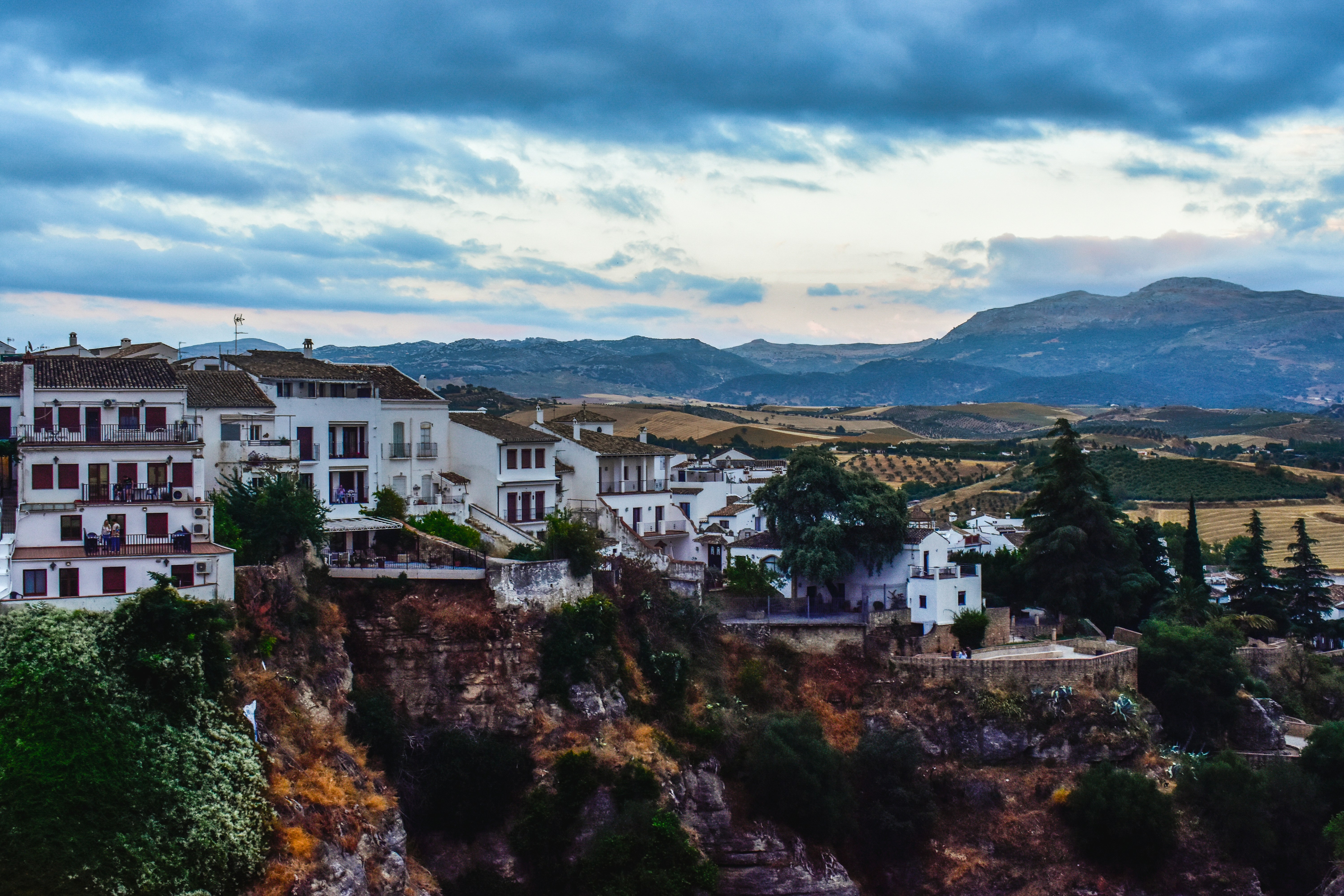 A view of a town with mountains in the background photo – Free Ronda ...