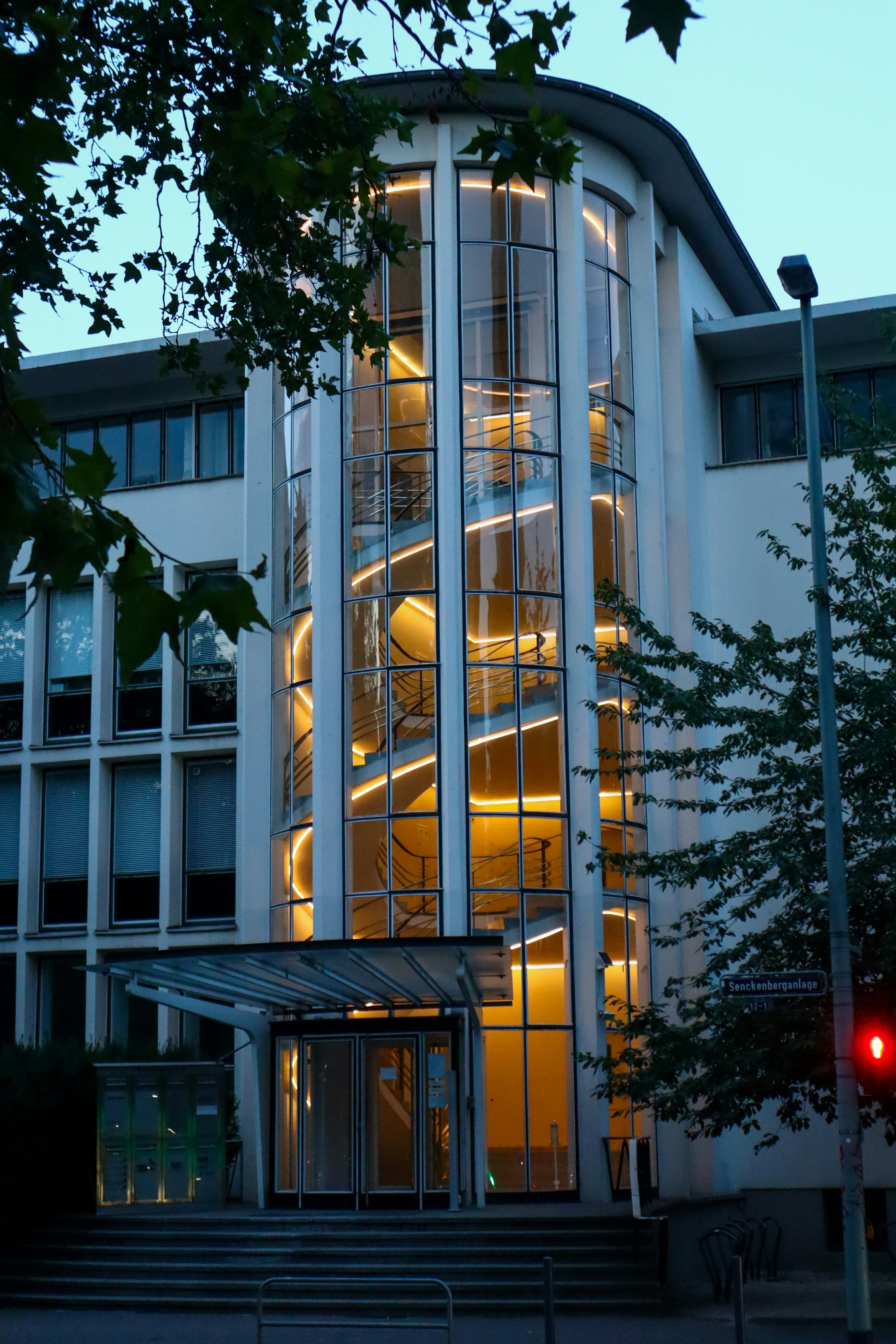 Spiral Light in a Glass Tower at Dusk