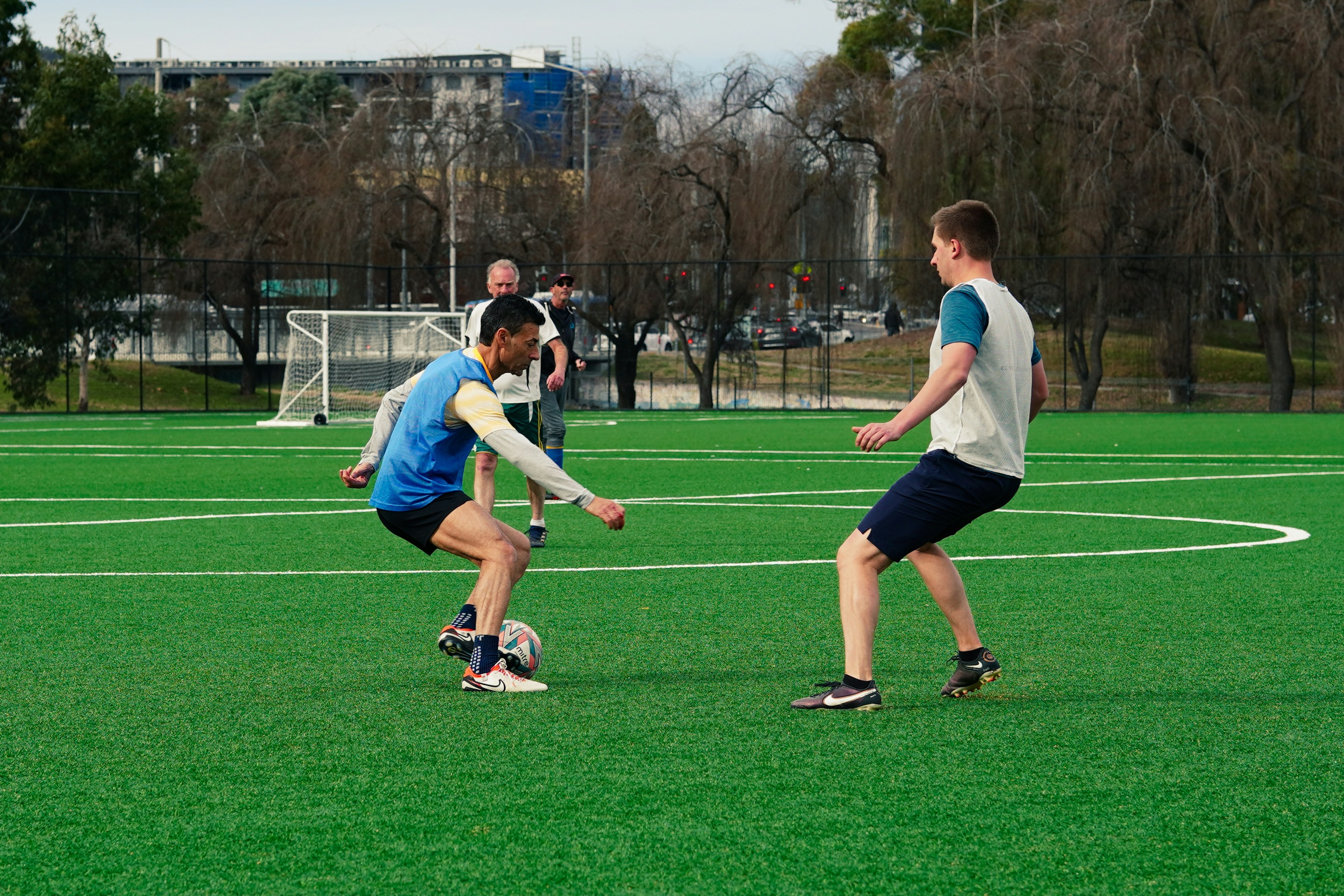 A group of young men playing a game of soccer photo – Free The ...