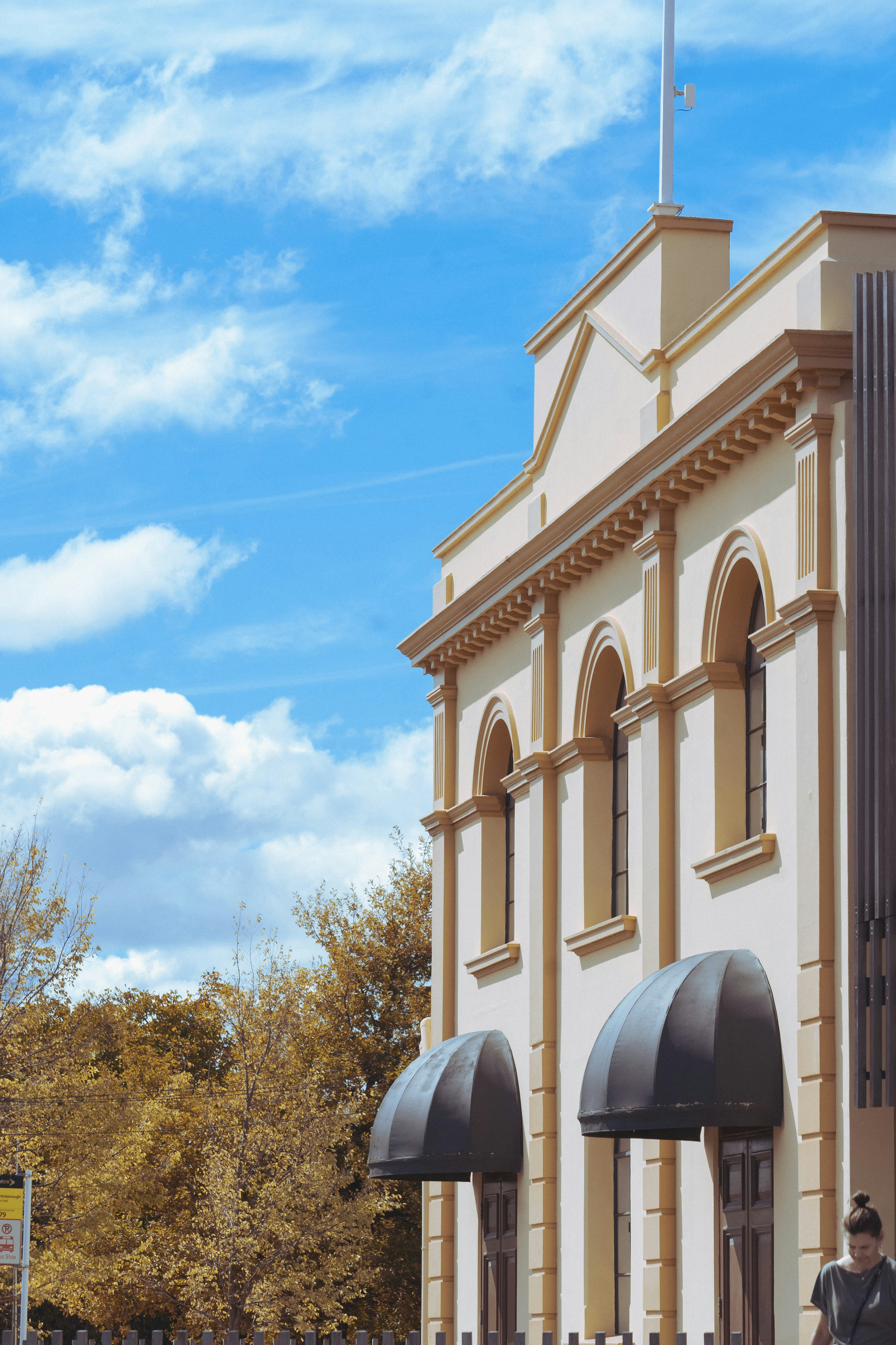 Autumn Light on a Neoclassical Facade with Arched Windows