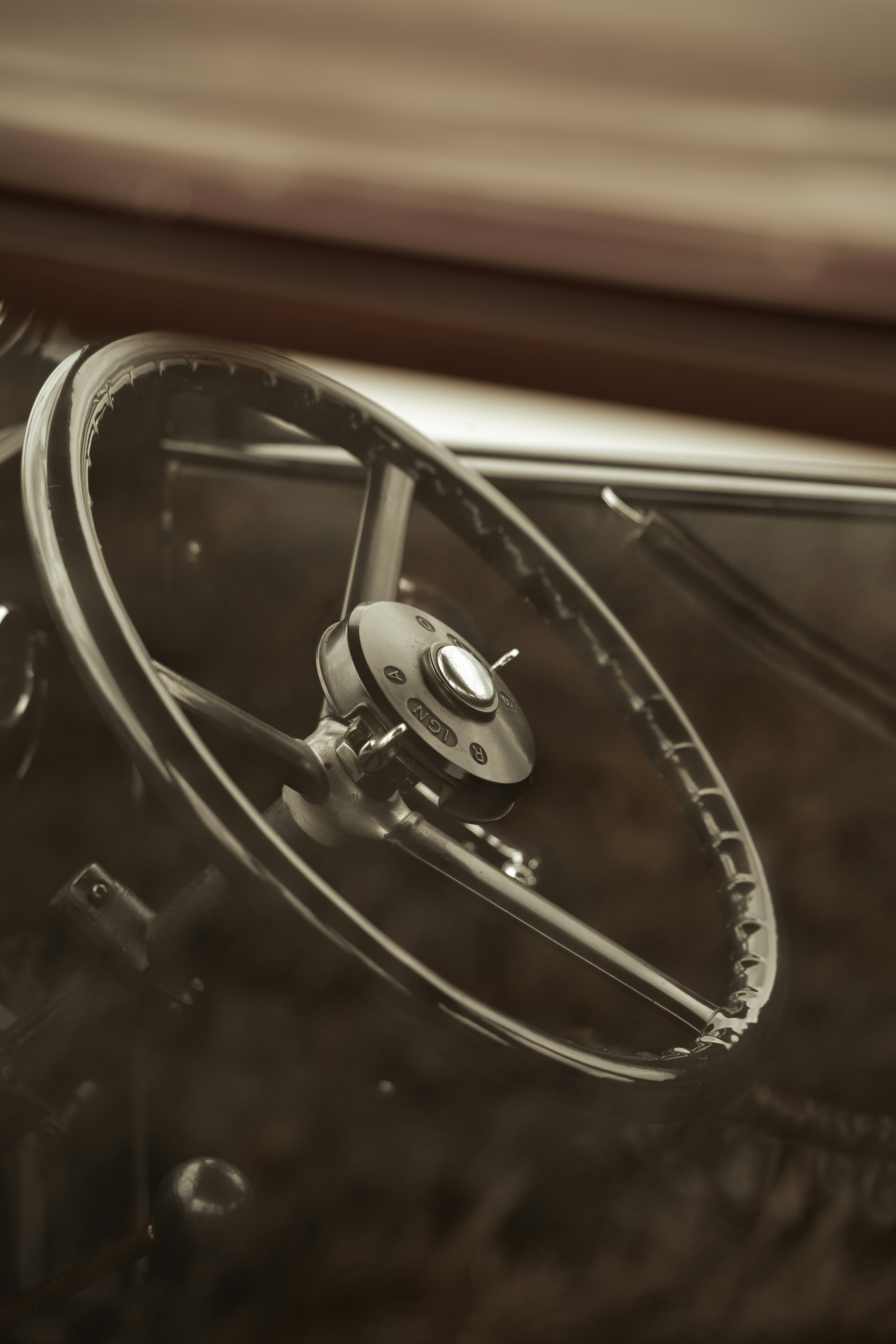 Sepia Ring of Time: The Vintage Steering Wheel in Quiet Focus