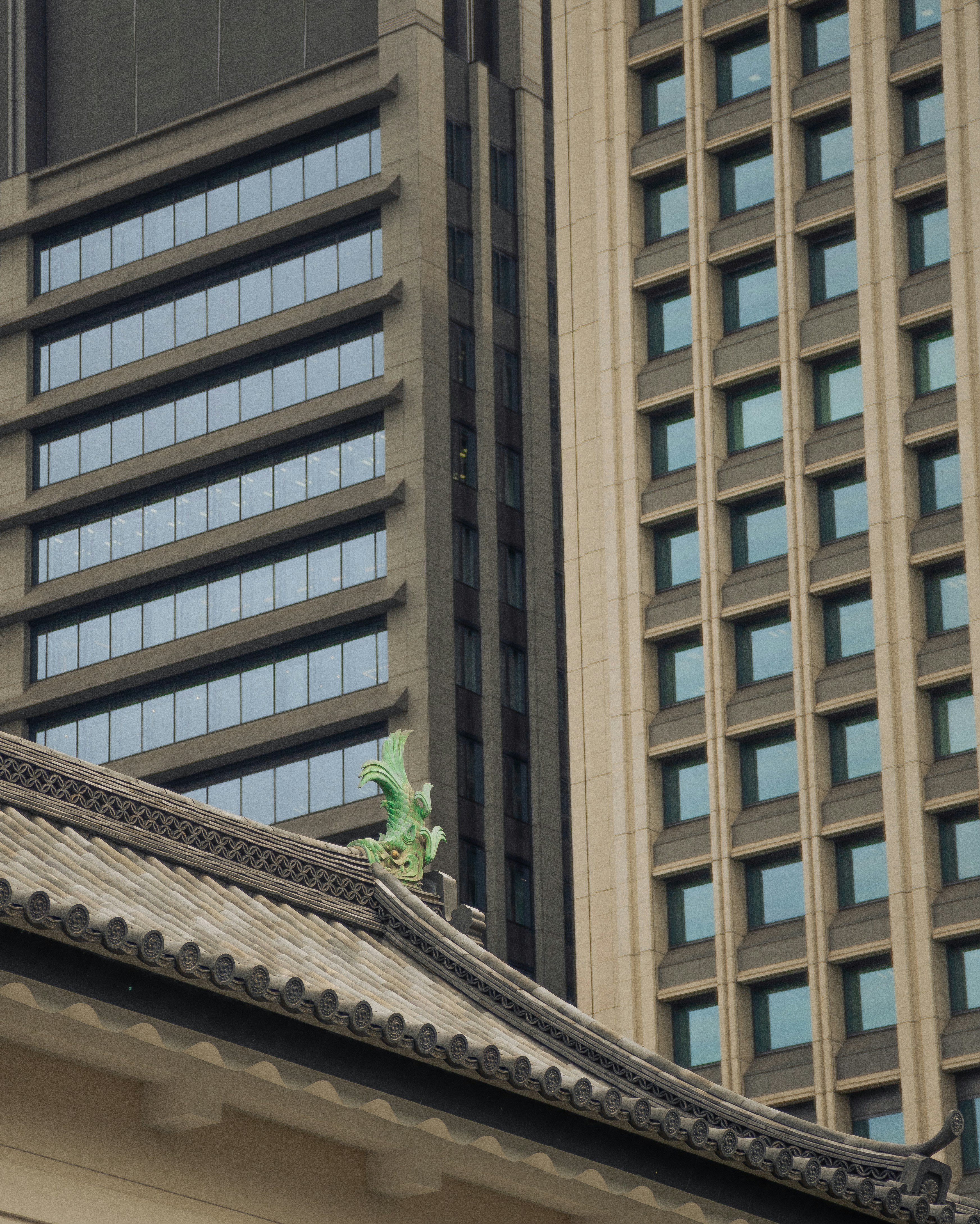 Emerald Dragon at the Rooftop Edge Beneath Glass Towers