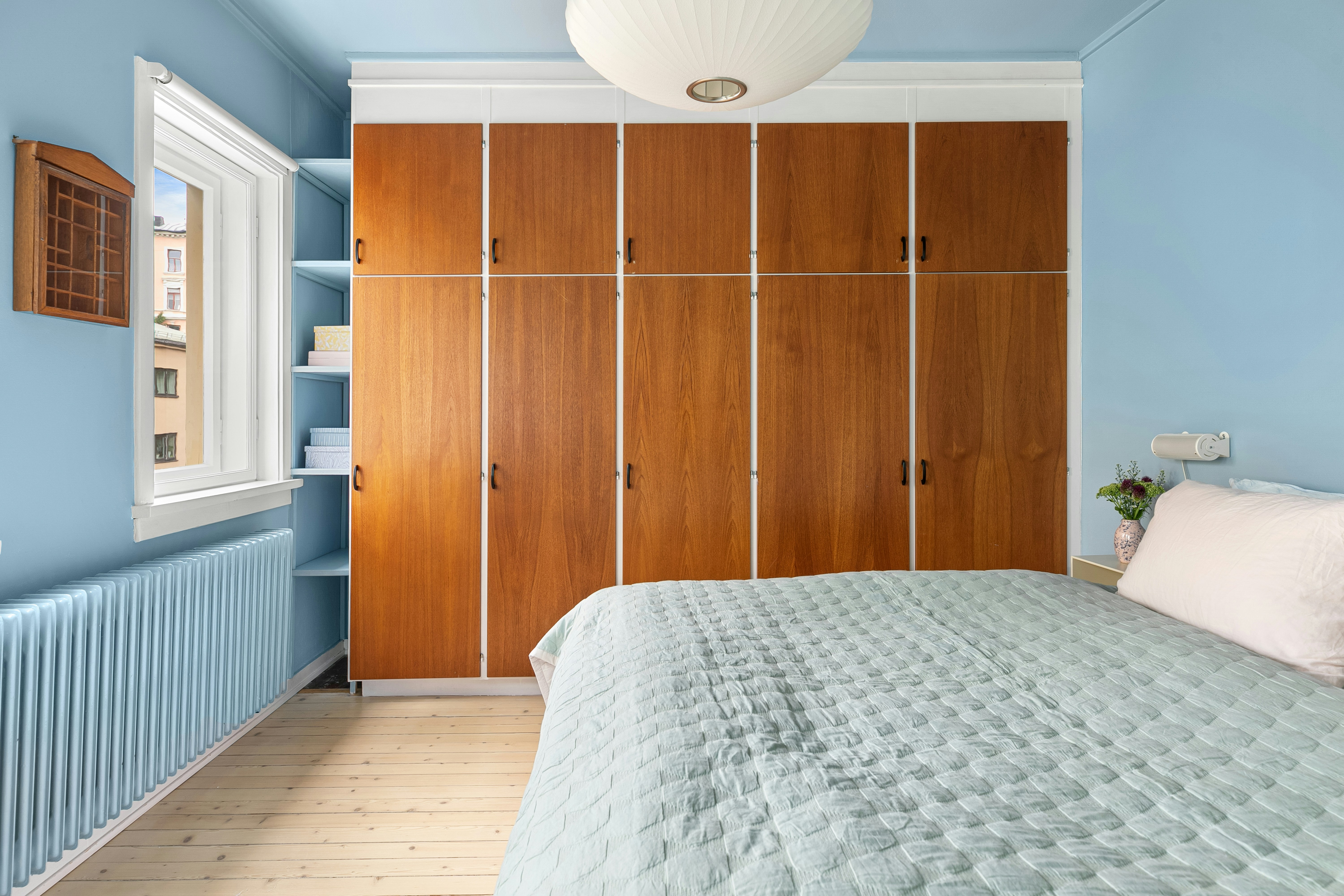 A bedroom with blue walls and a white bed photo – Free Image on Unsplash