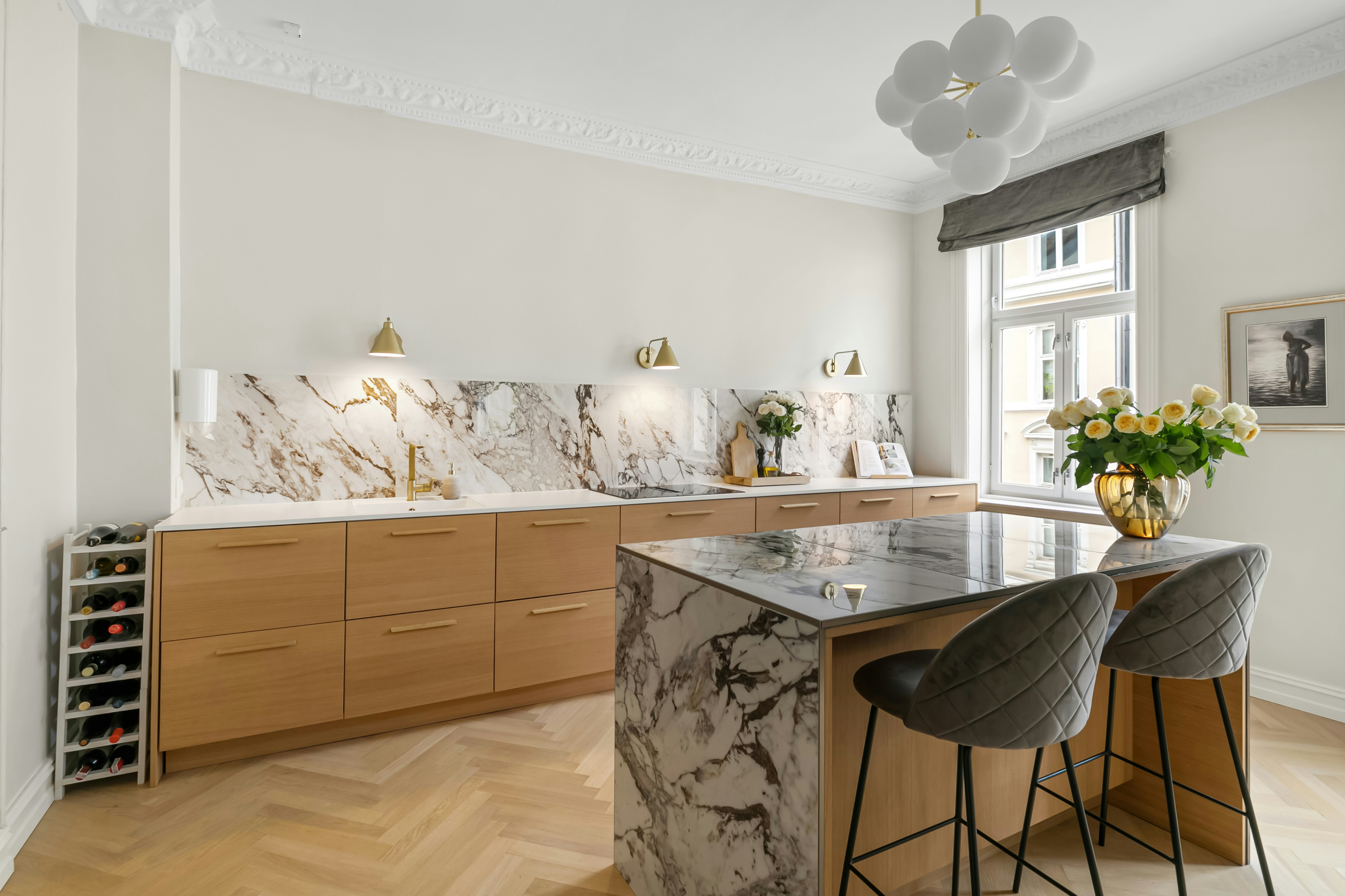 A kitchen with marble counter tops and wooden floors photo – Free Image ...