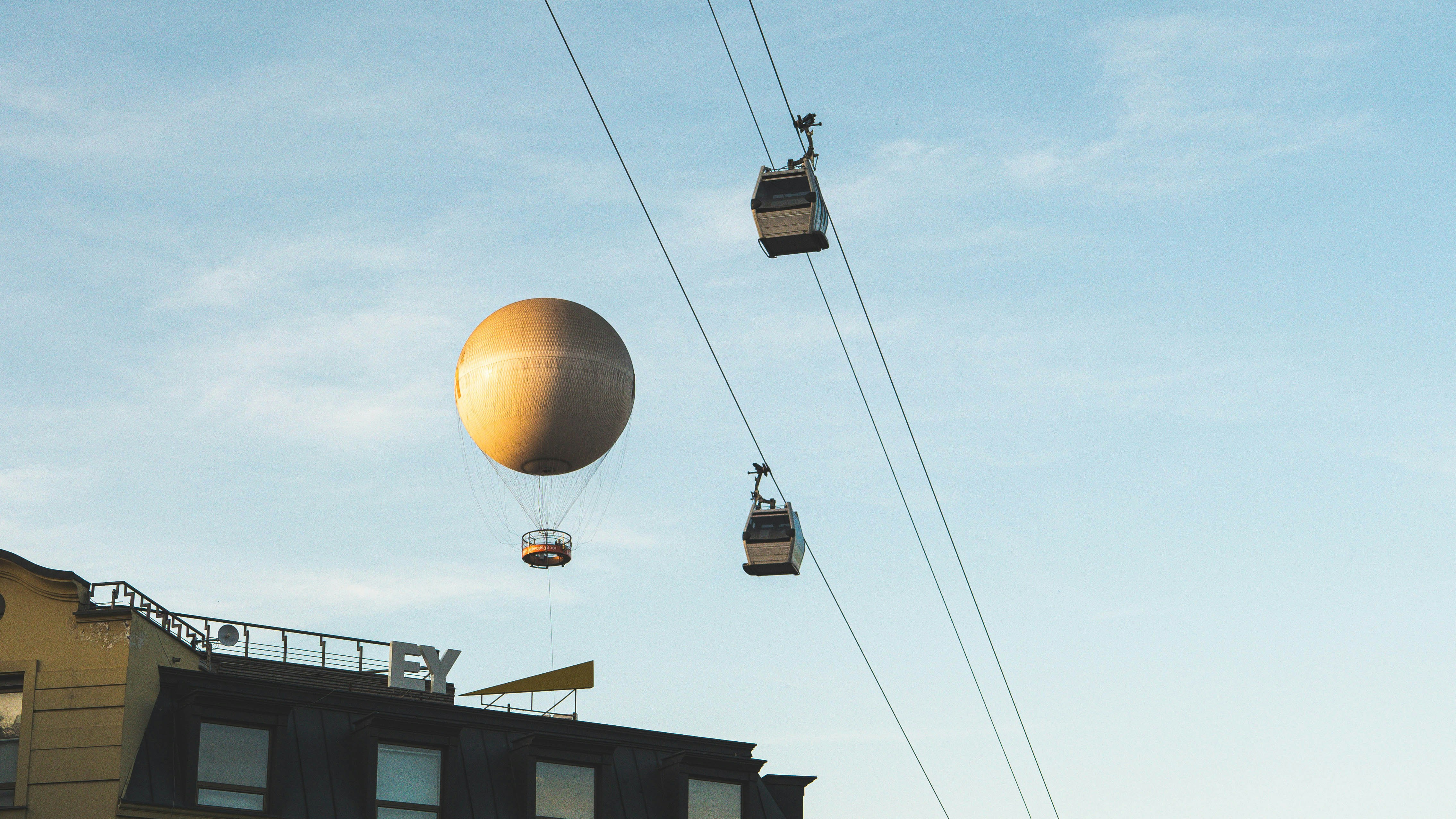A group of people riding on top of a ski lift