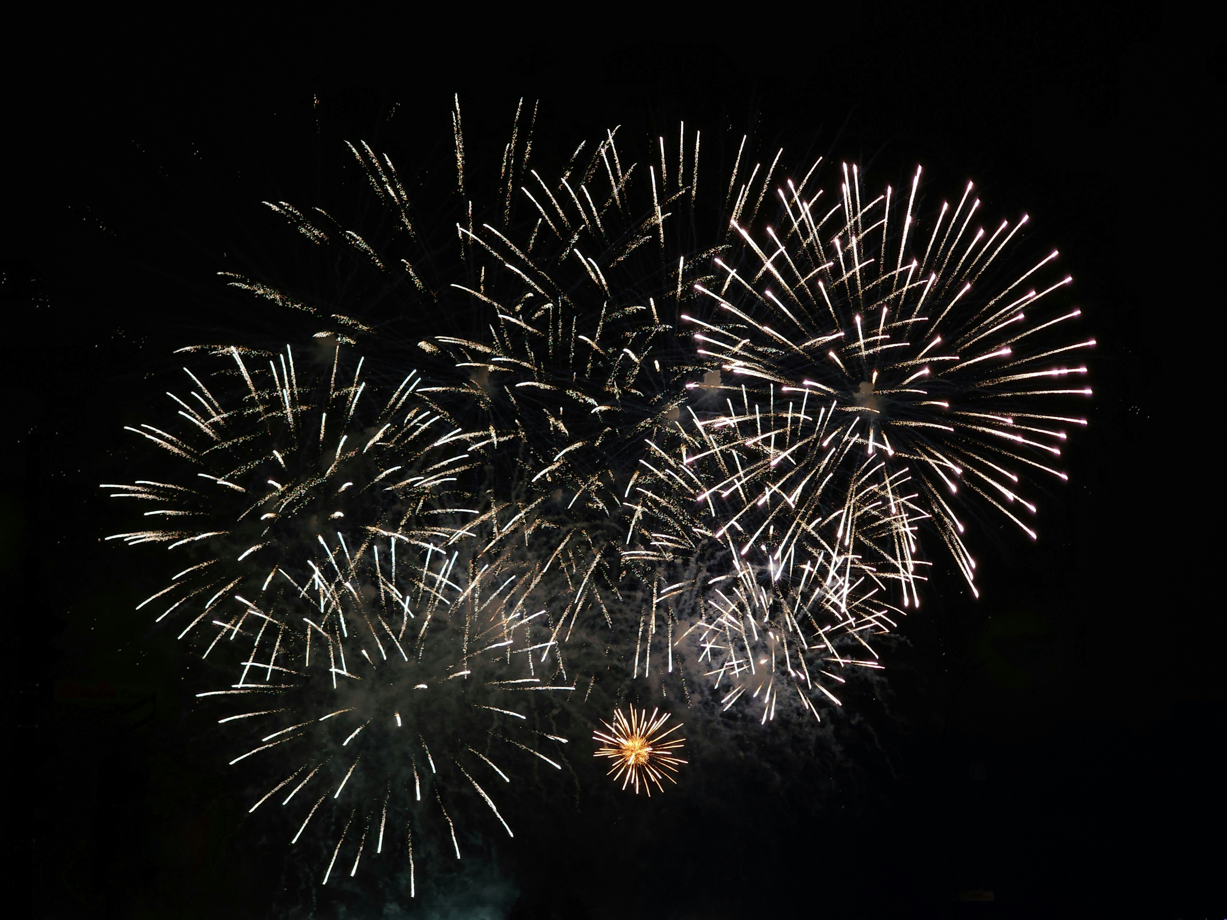 A bunch of fireworks are lit up in the night sky photo – Free Canada ...