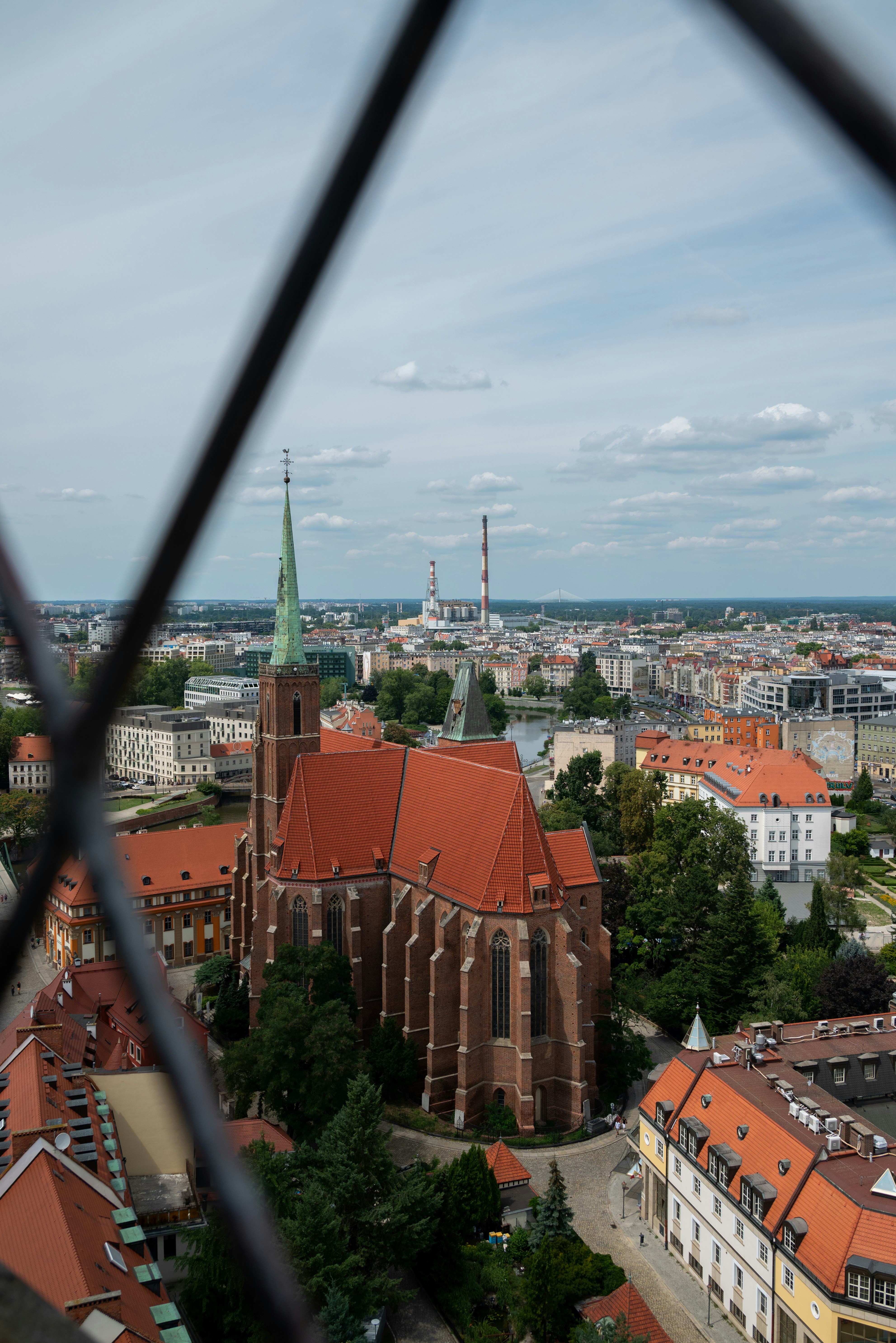 Green Spire Over Red Rooftops: A Cathedral in a Modern Town