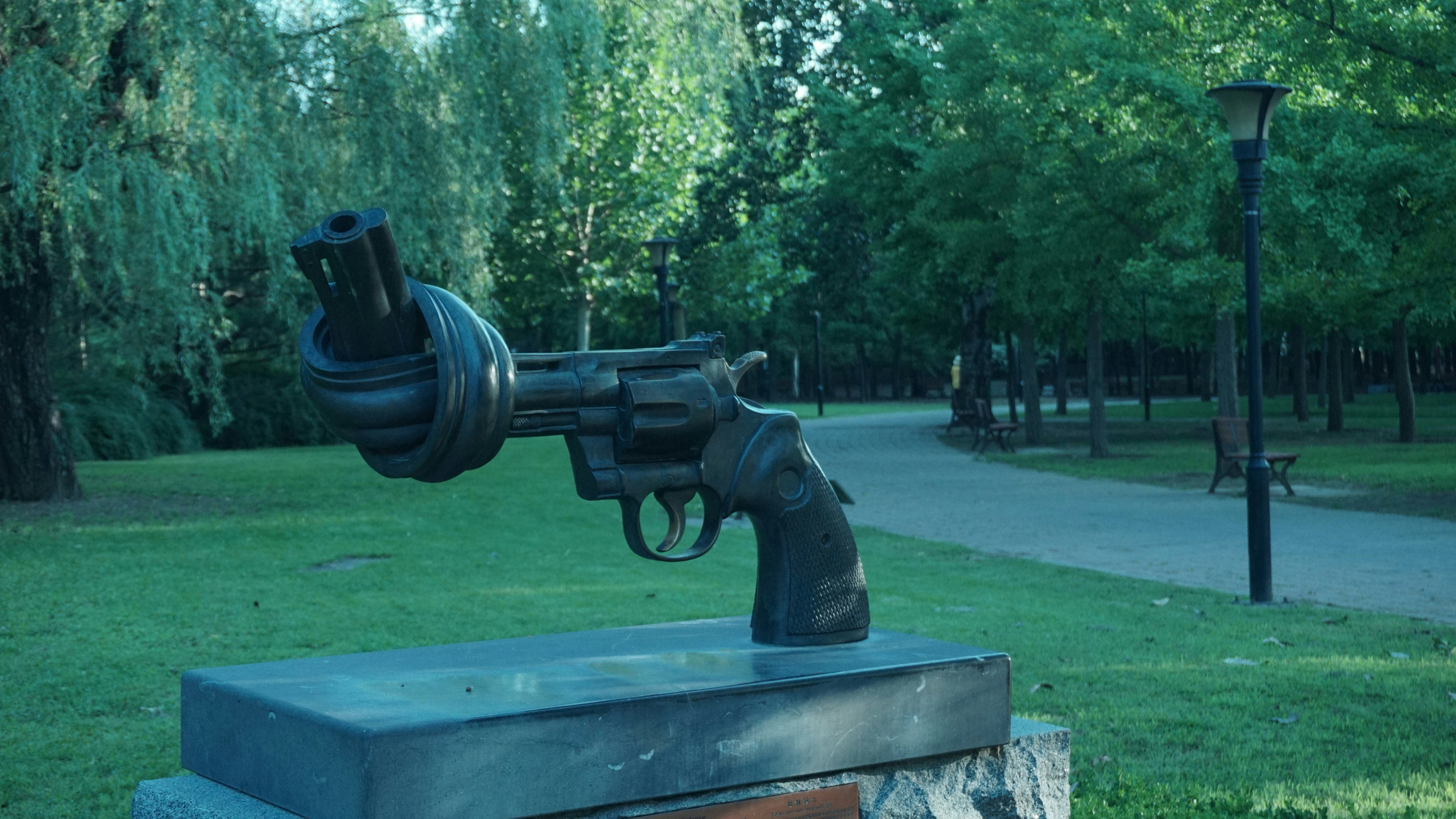 Iron Sentinel: A Revolver Sculpture Quietly Guarding the Park Path