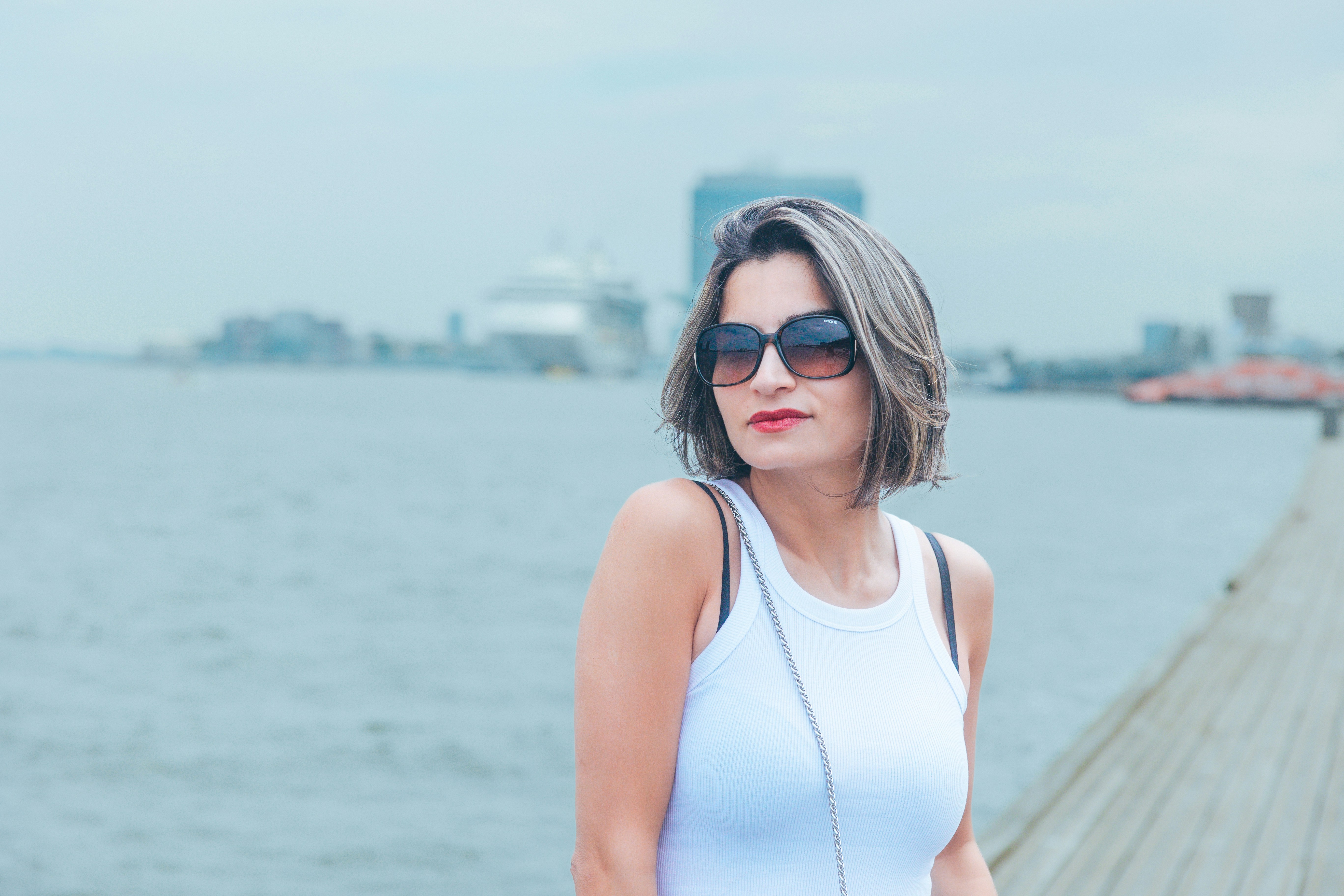 Coastal Confidence: Sunglasses and Sea Breeze
