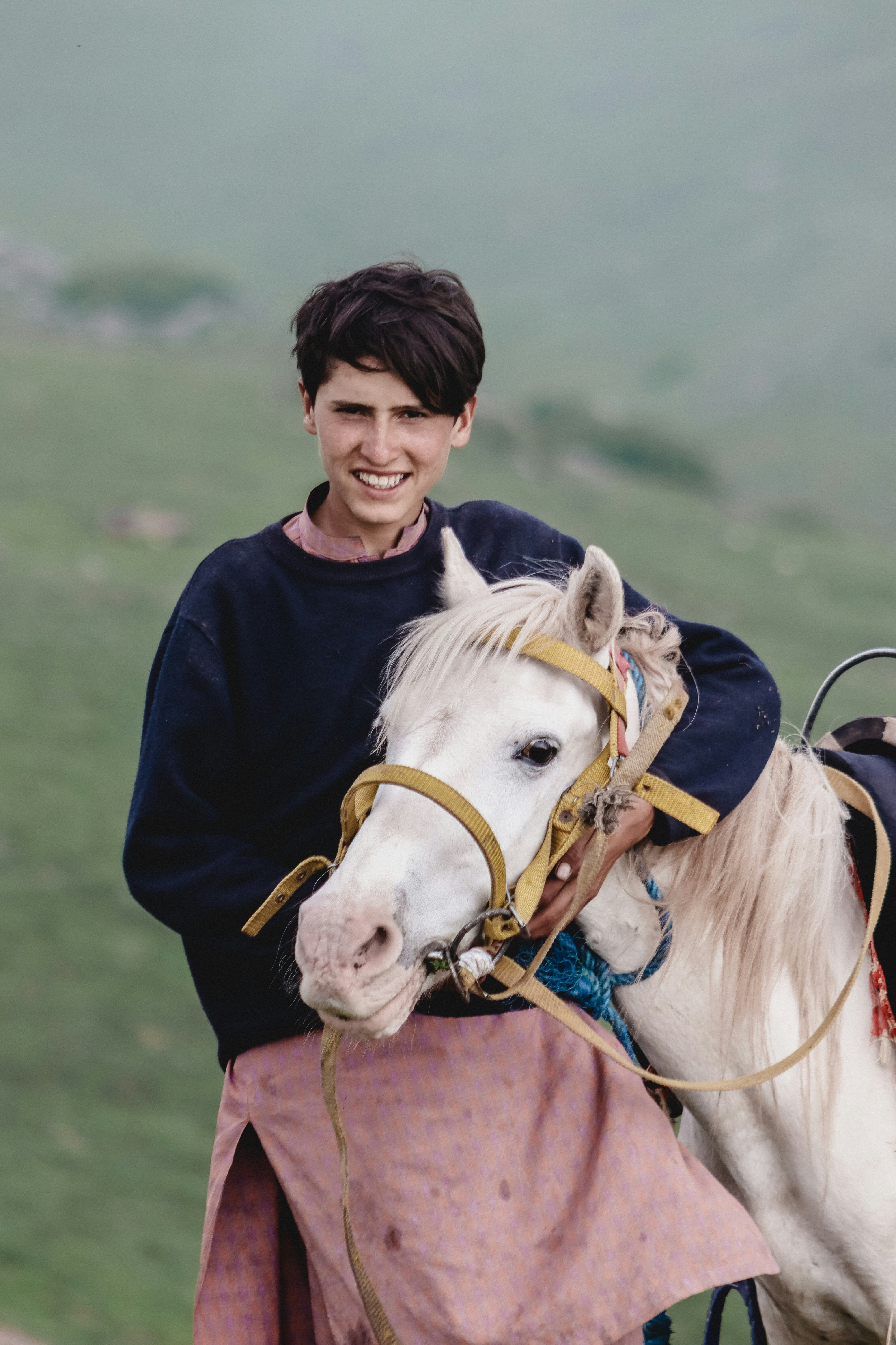 Emerald Hillside Bond: A Young Rider and White Horse