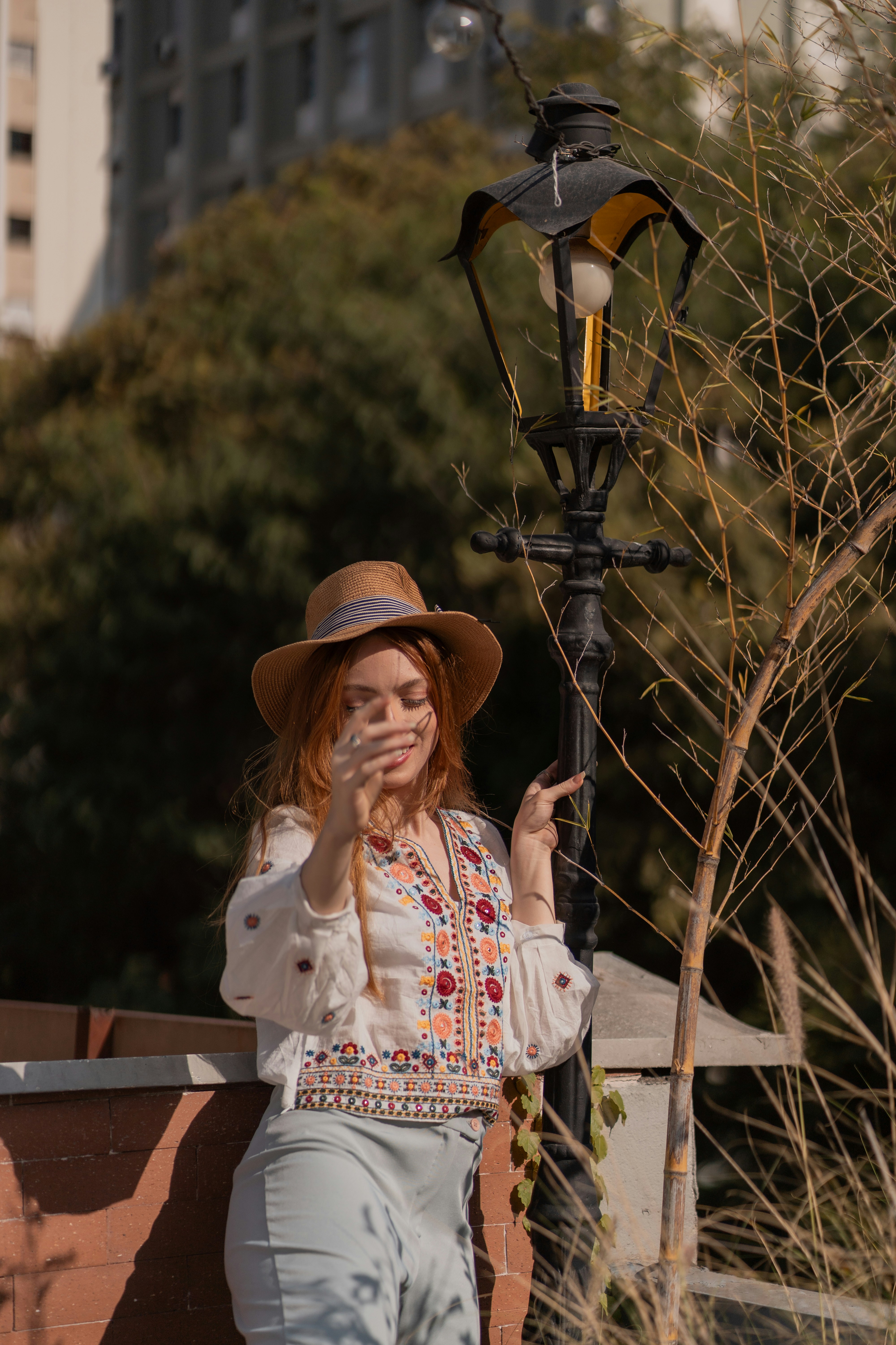 Sunlit Bohemian Moment by the Urban Lantern