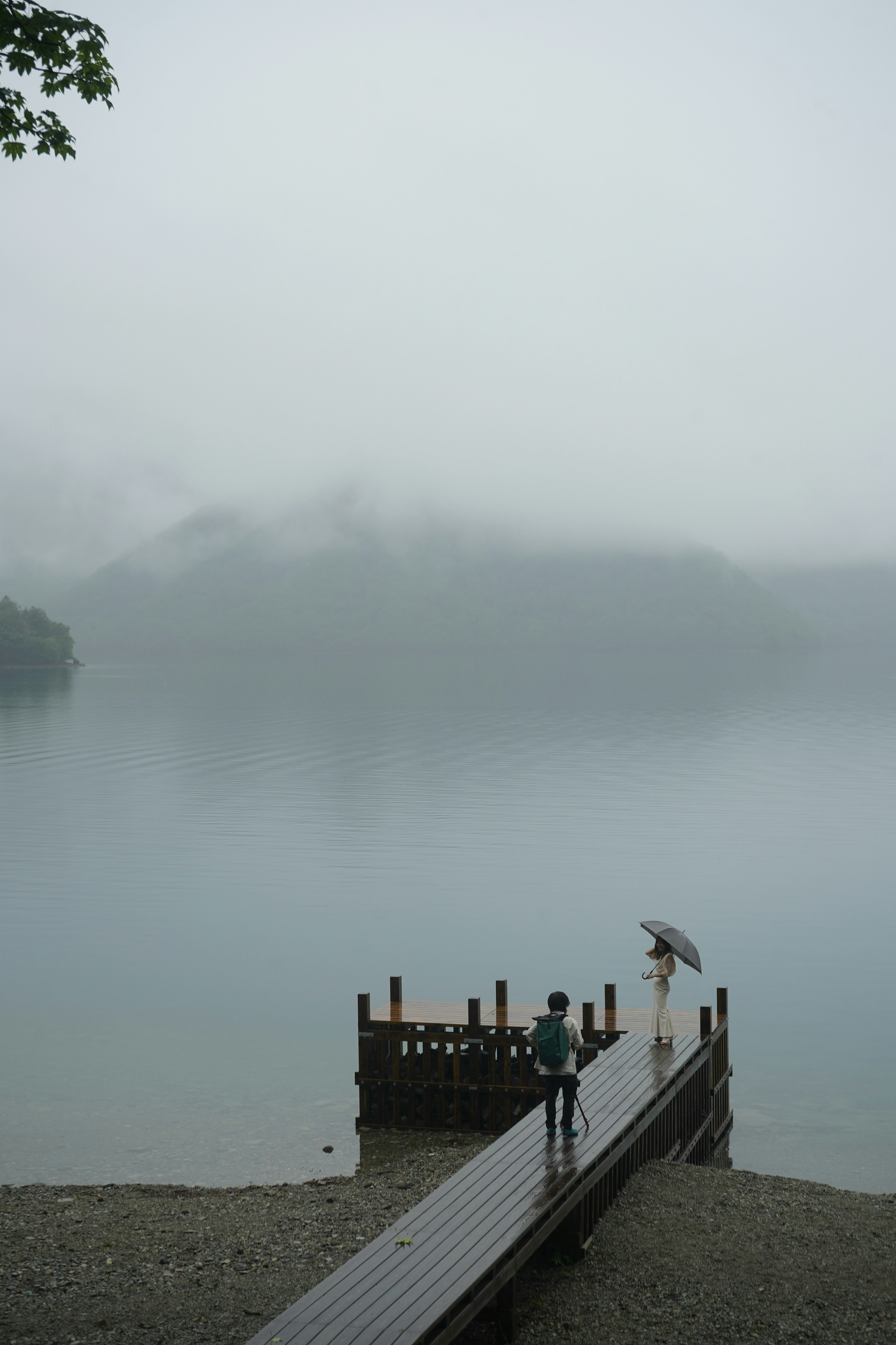 Mist over the Pier: Quiet Figures at the Lake's Edge
