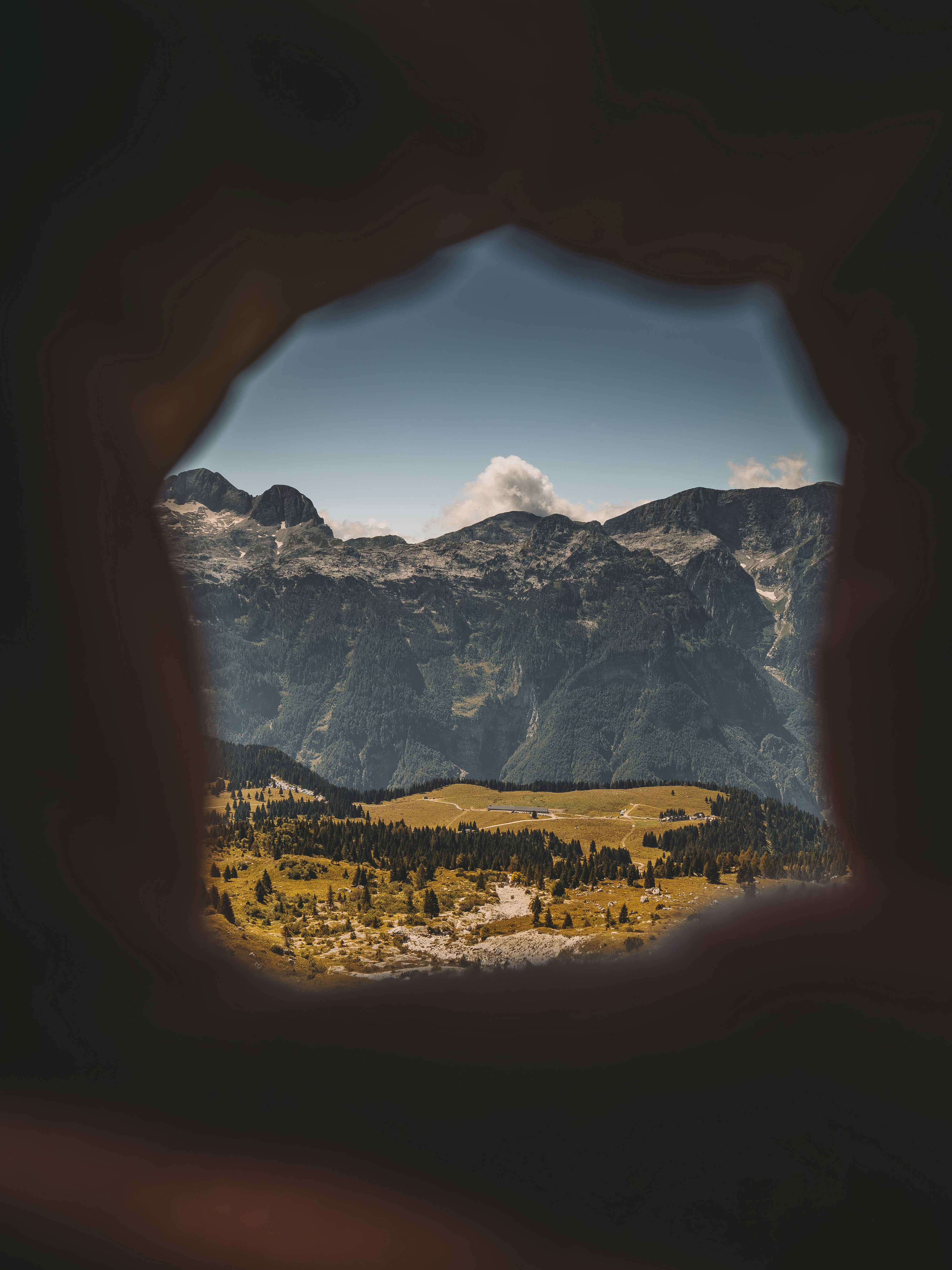 Opening a Mountain Window: Valley and Peaks Framed by a Dark Foreground