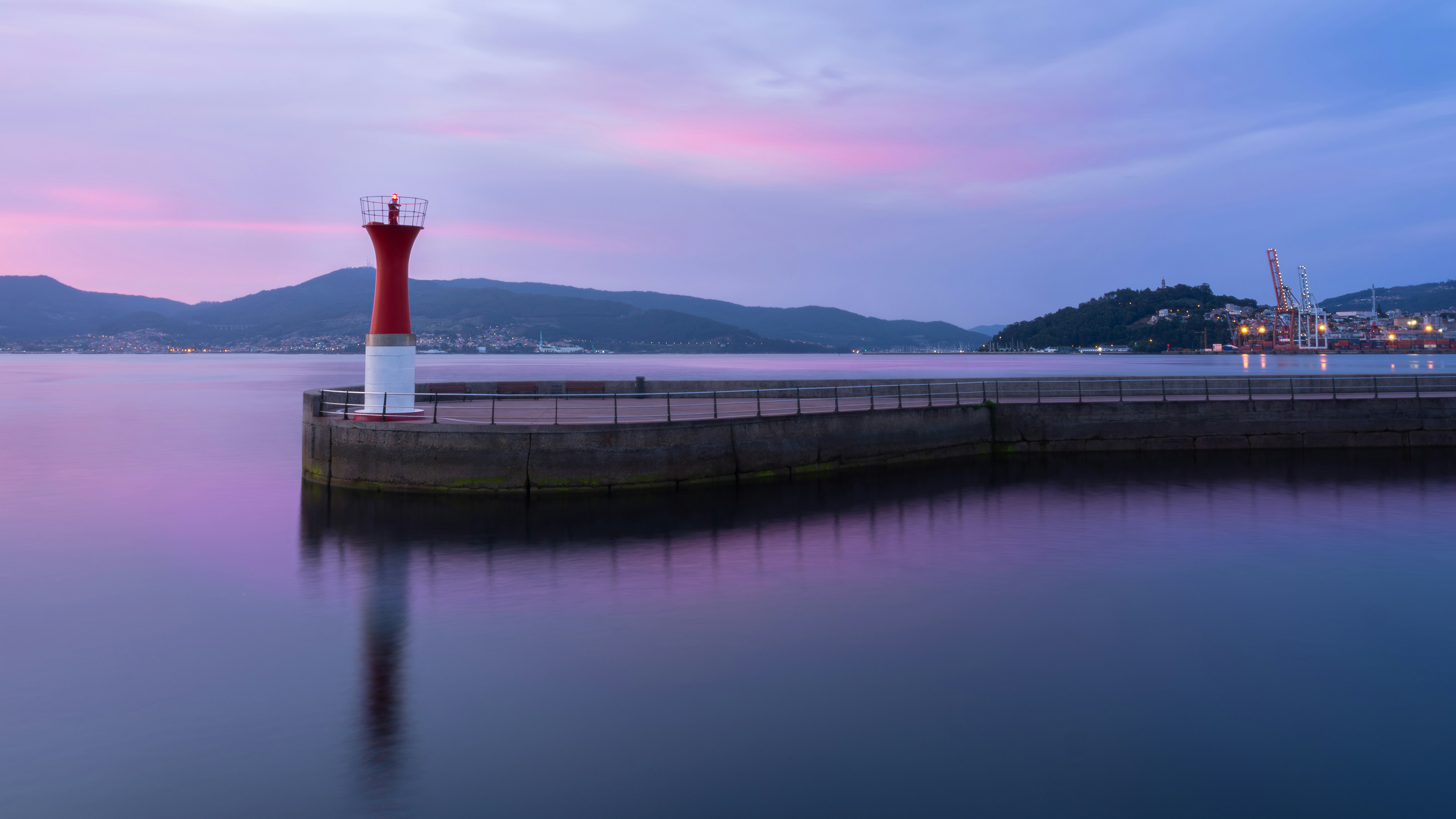 A red and white lighthouse sitting on top of a pier photo – Free Vigo ...