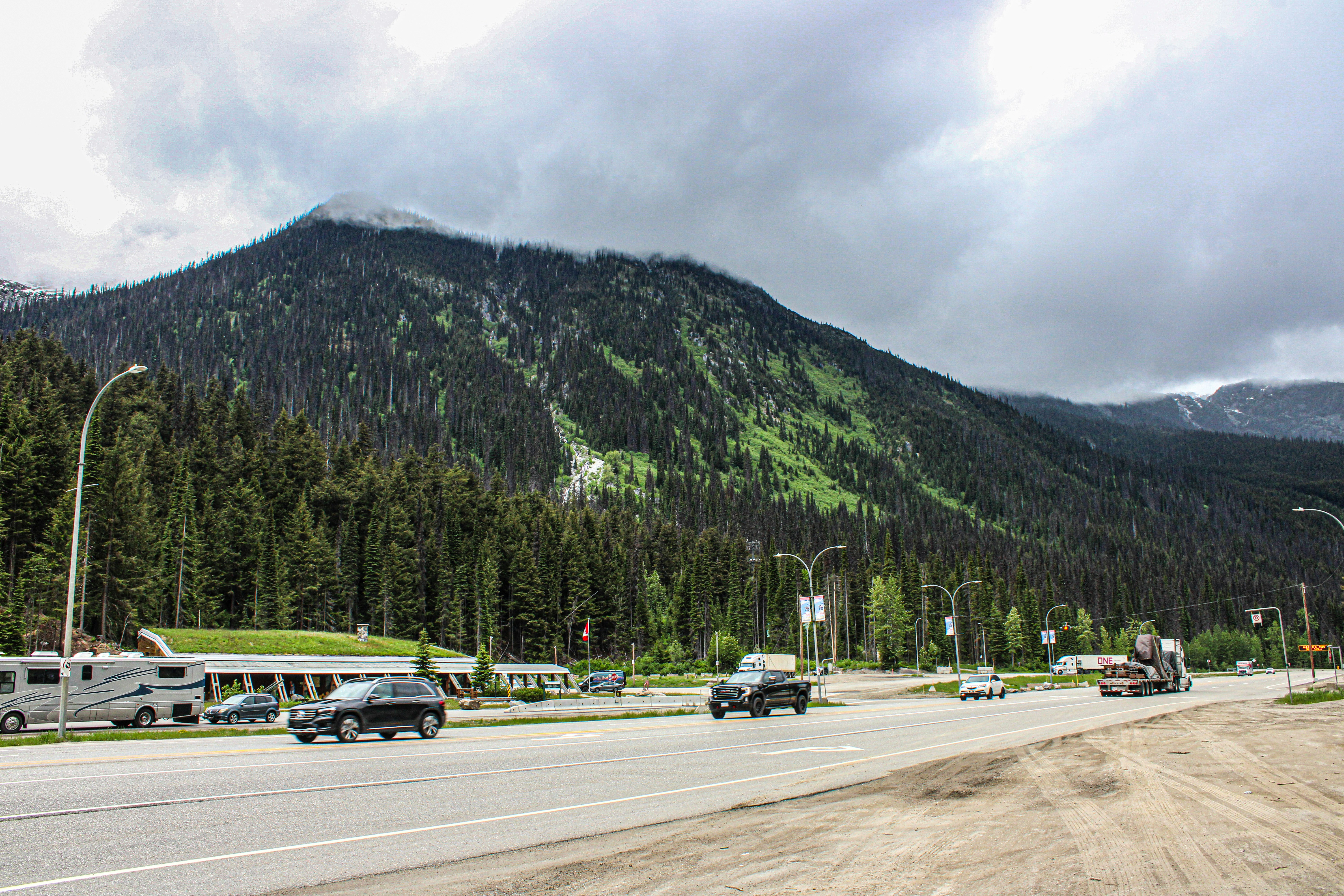 Mountain Roadside Vista Beneath Rainy Skies