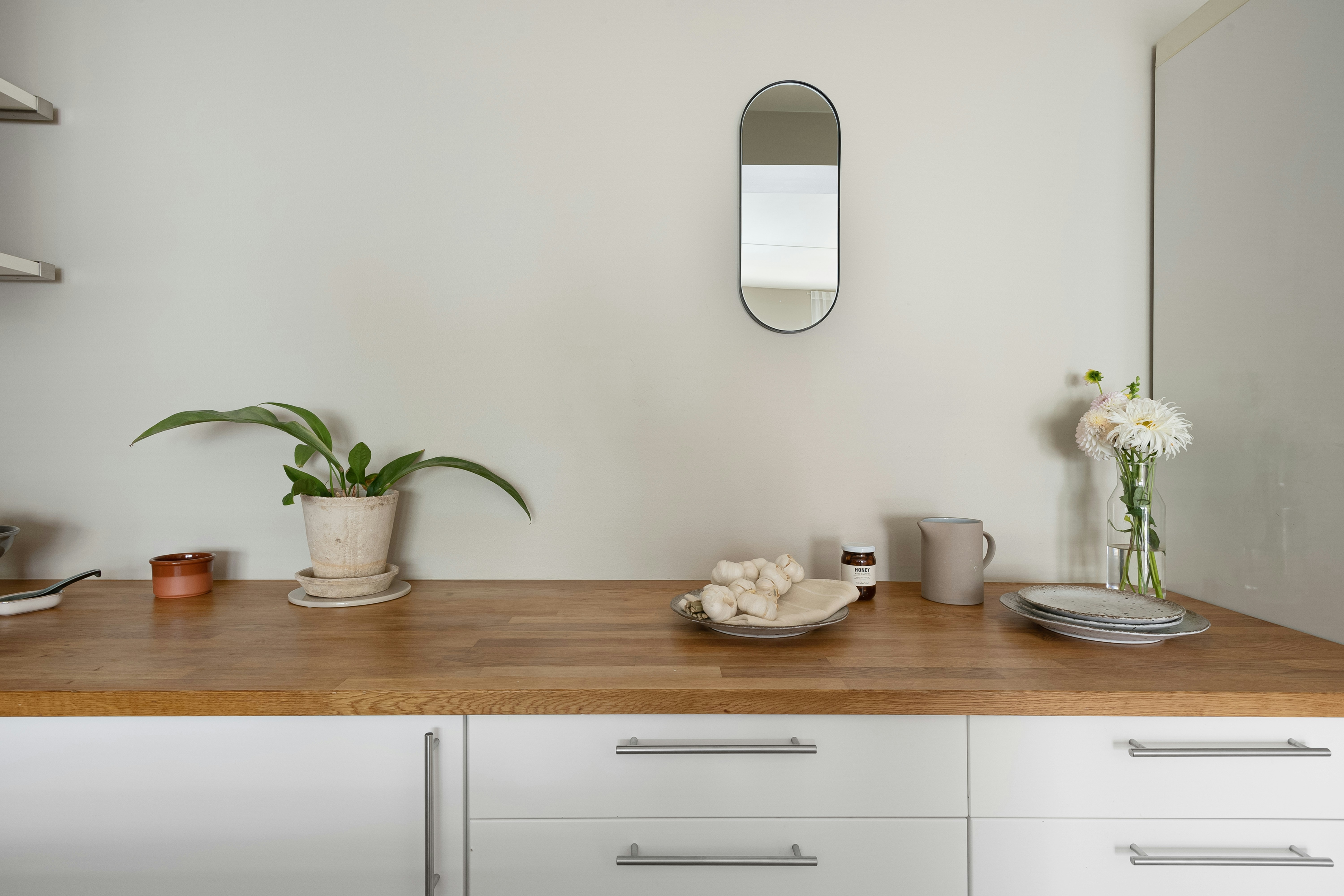 A white kitchen with a wooden counter top photo – Free Indoors Image on ...