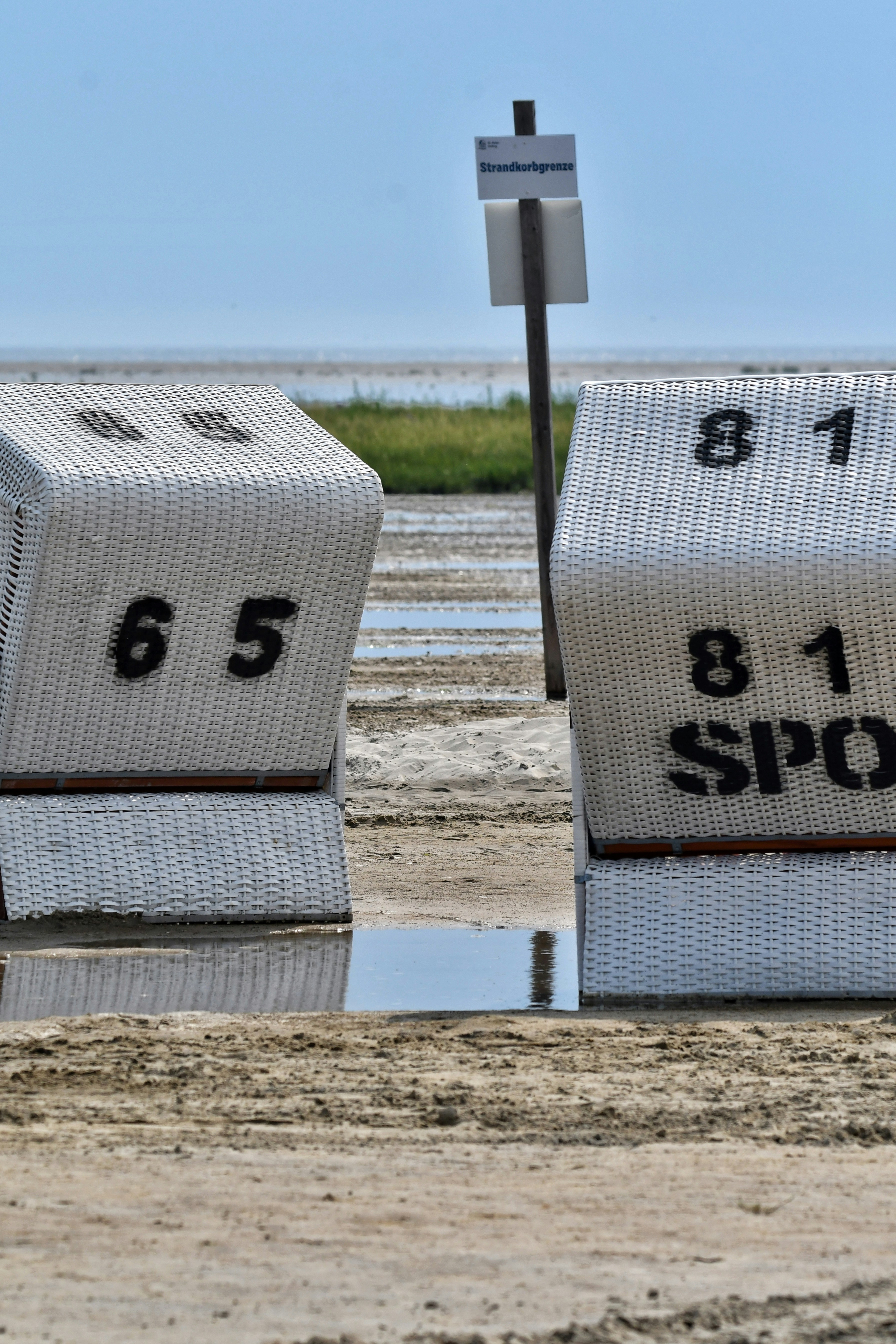 Lighthouse of Numbers: Beachside Benches and Distant Sea