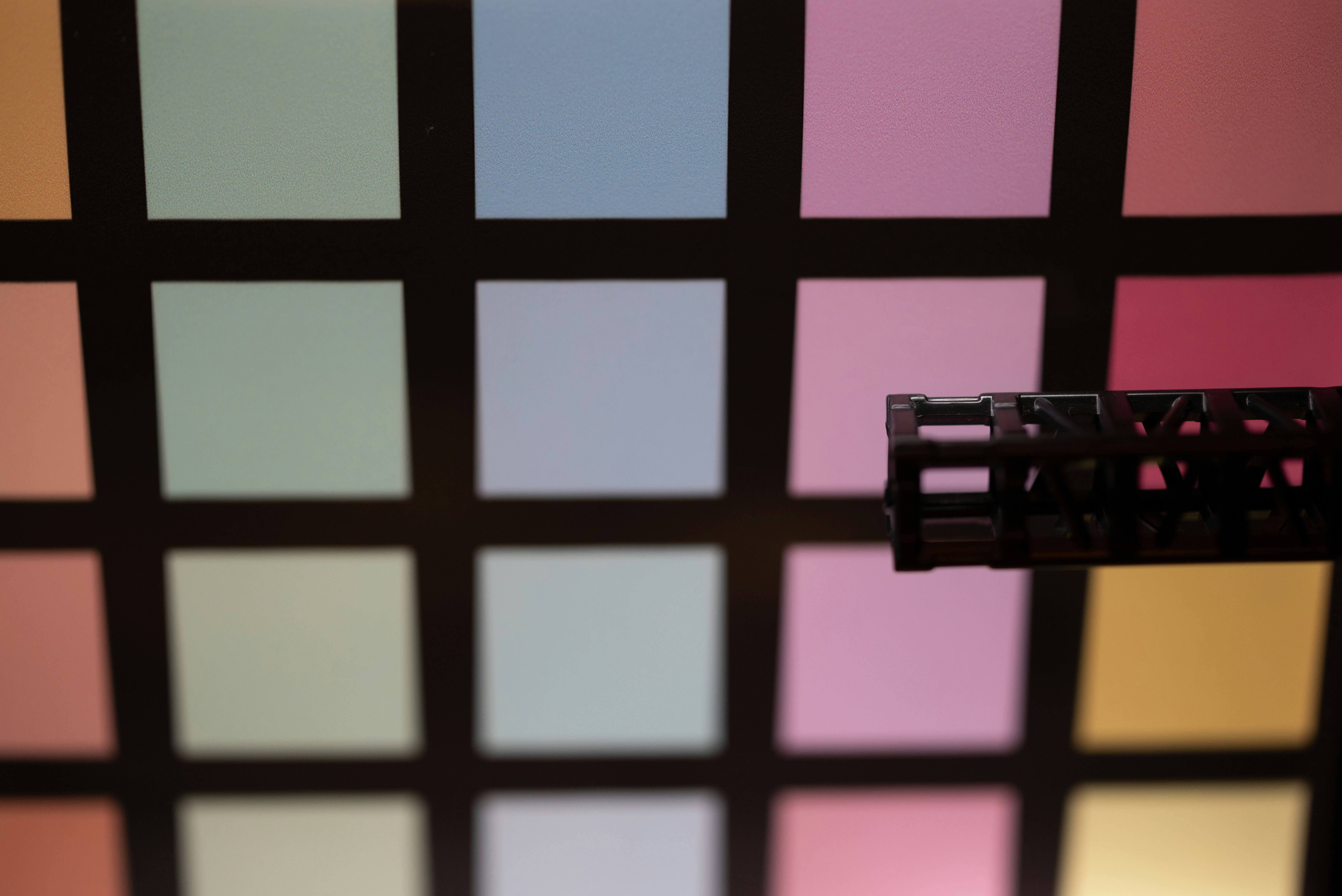 Pastel Checkerboard Backdrop Meets a Minimalist Mechanical Detail