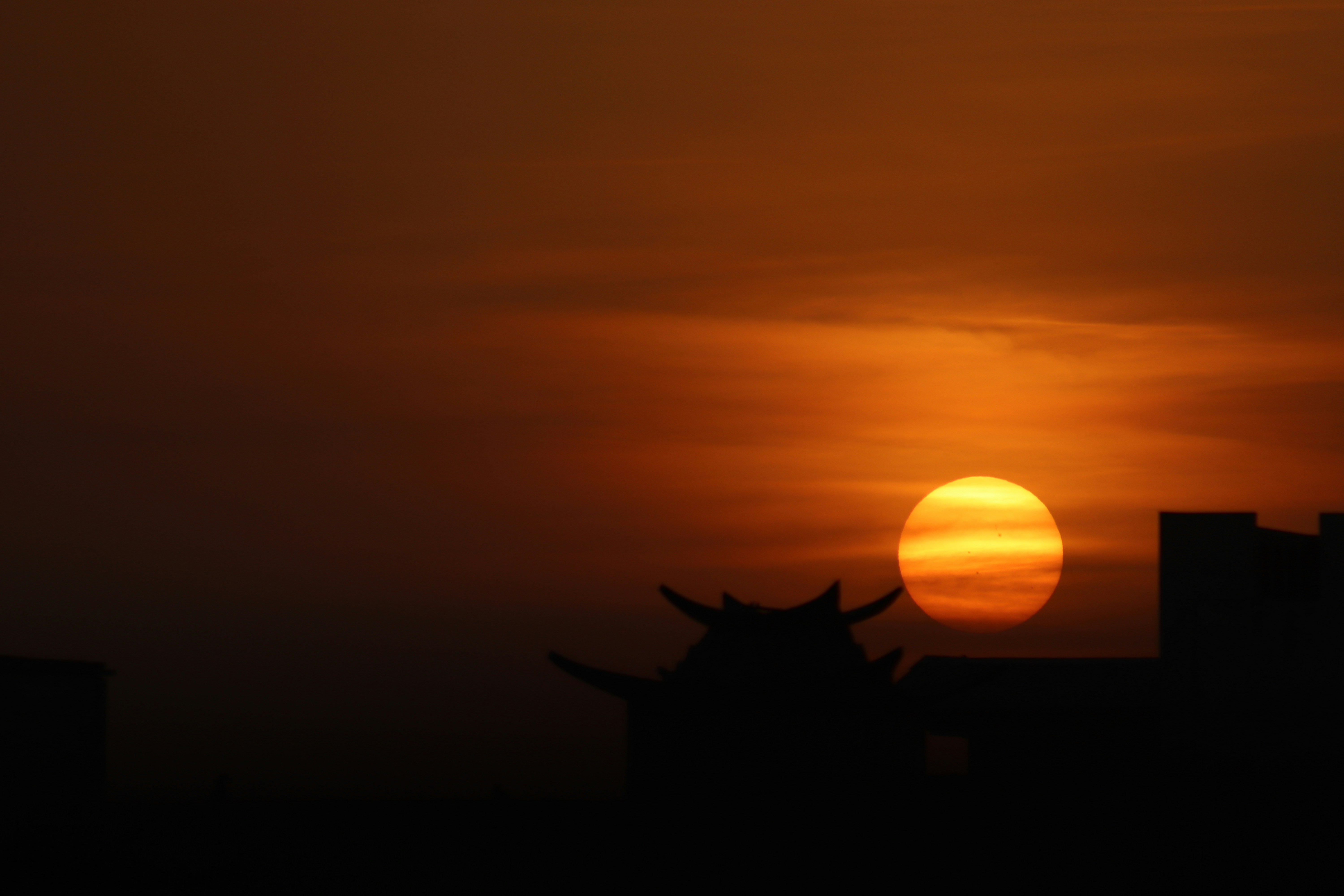 Golden Sun Over a Pagoda Horizon