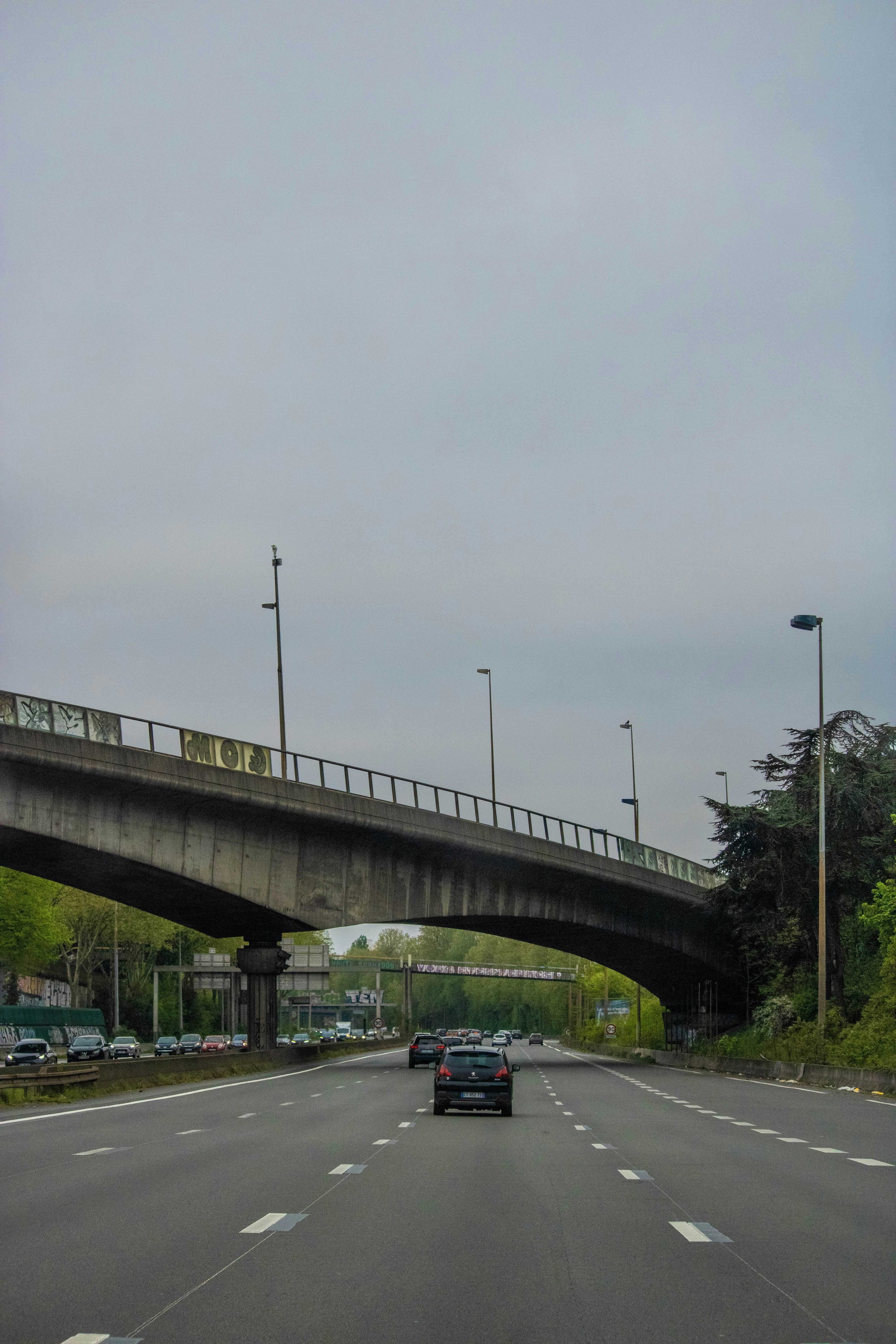 Overpass Arc Over a Multilane Highway Toward a Distant Horizon