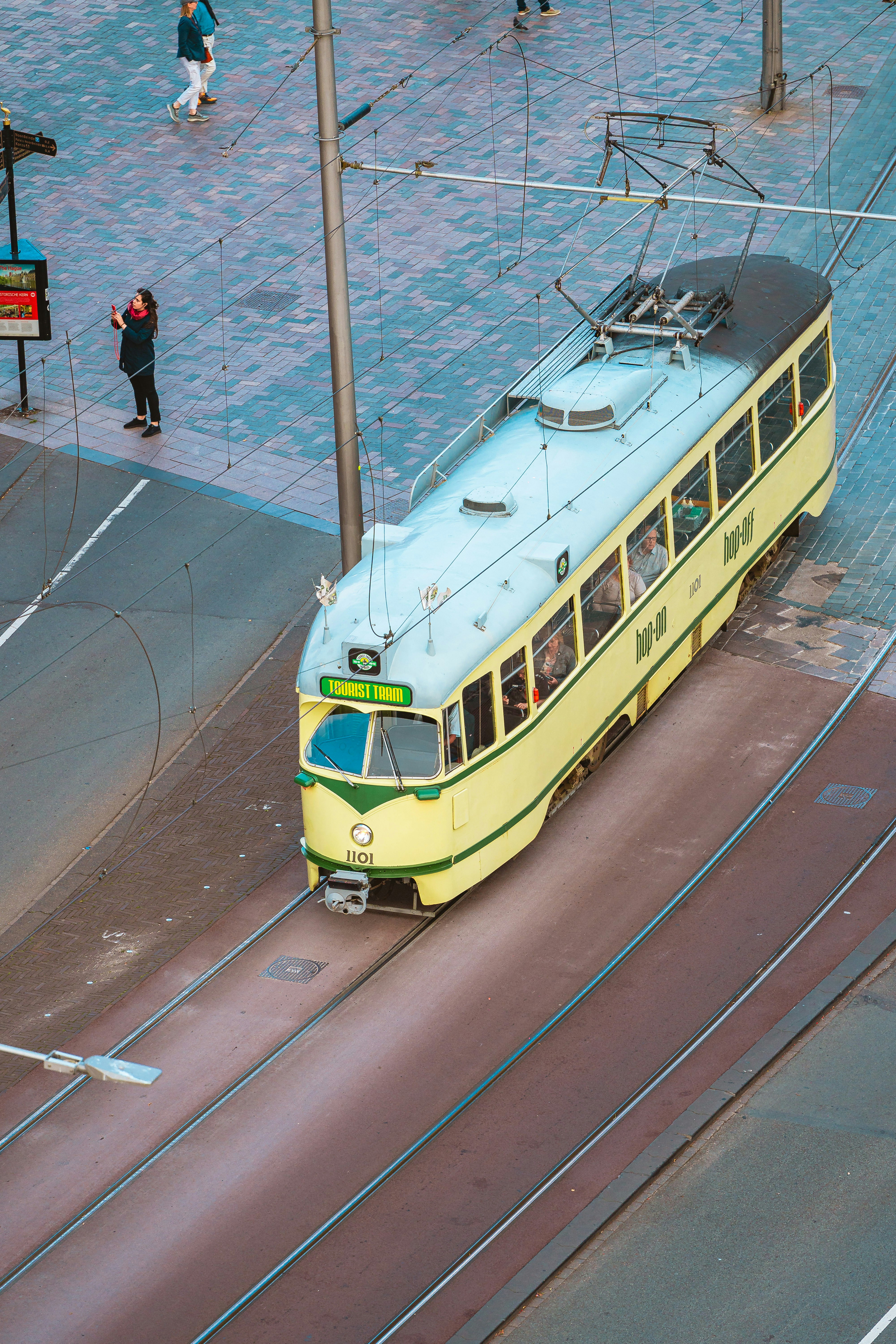 Pastel Streetcar Rides the Rails Through a Painted Plaza