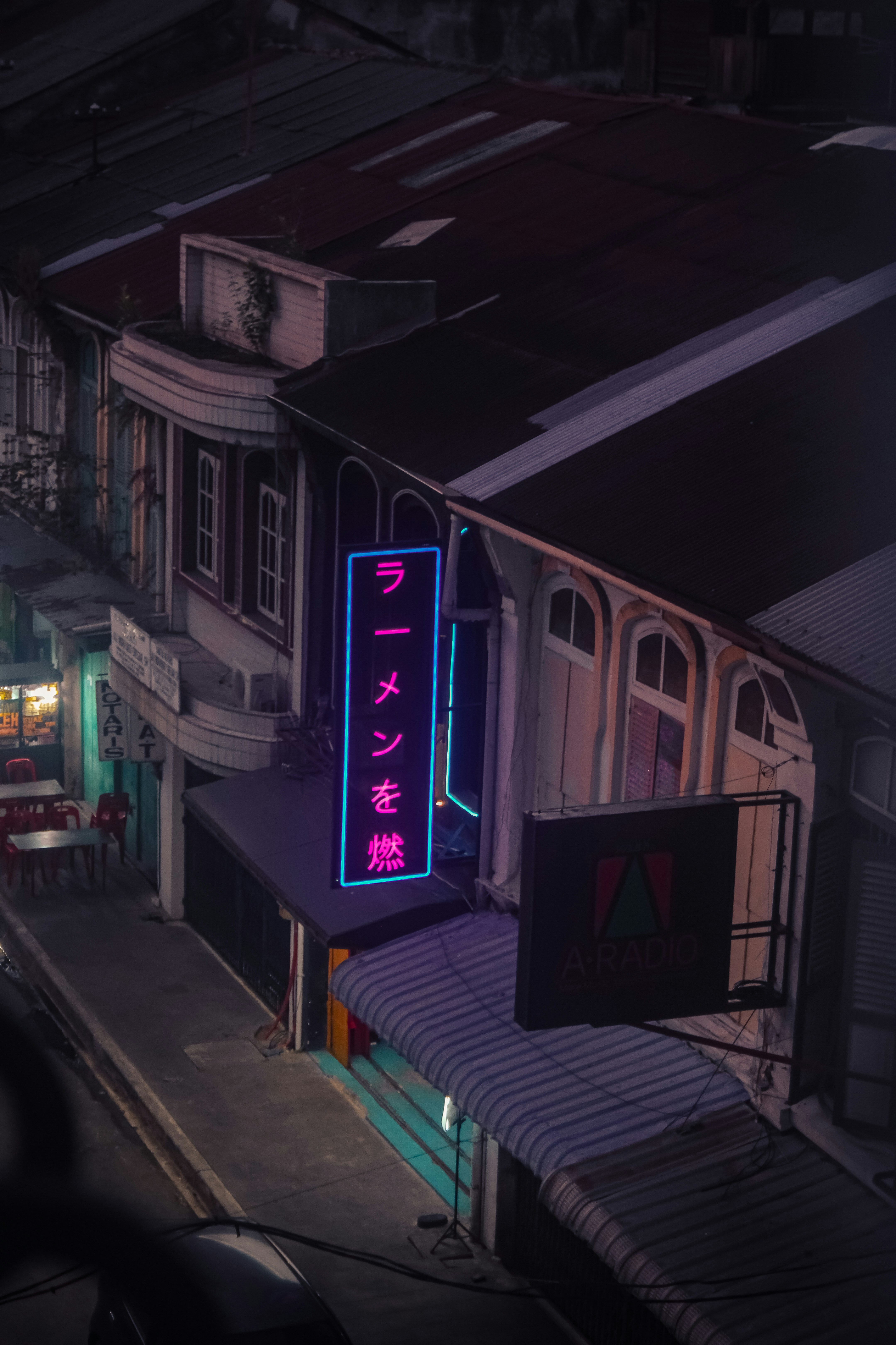 Night | A building with a neon sign on the side of it